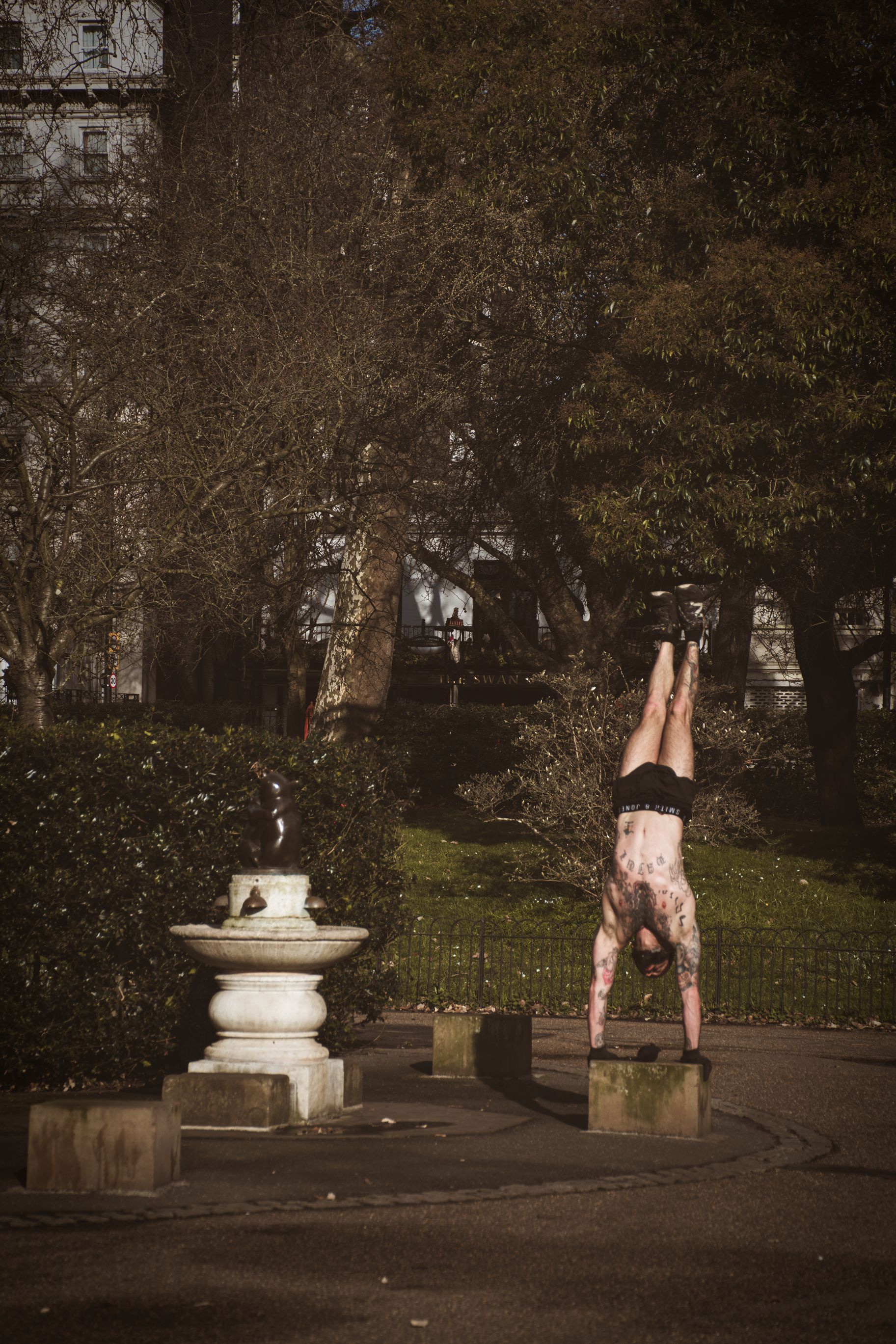 Shirtless Man Doing a Handstand · Free Stock Photo