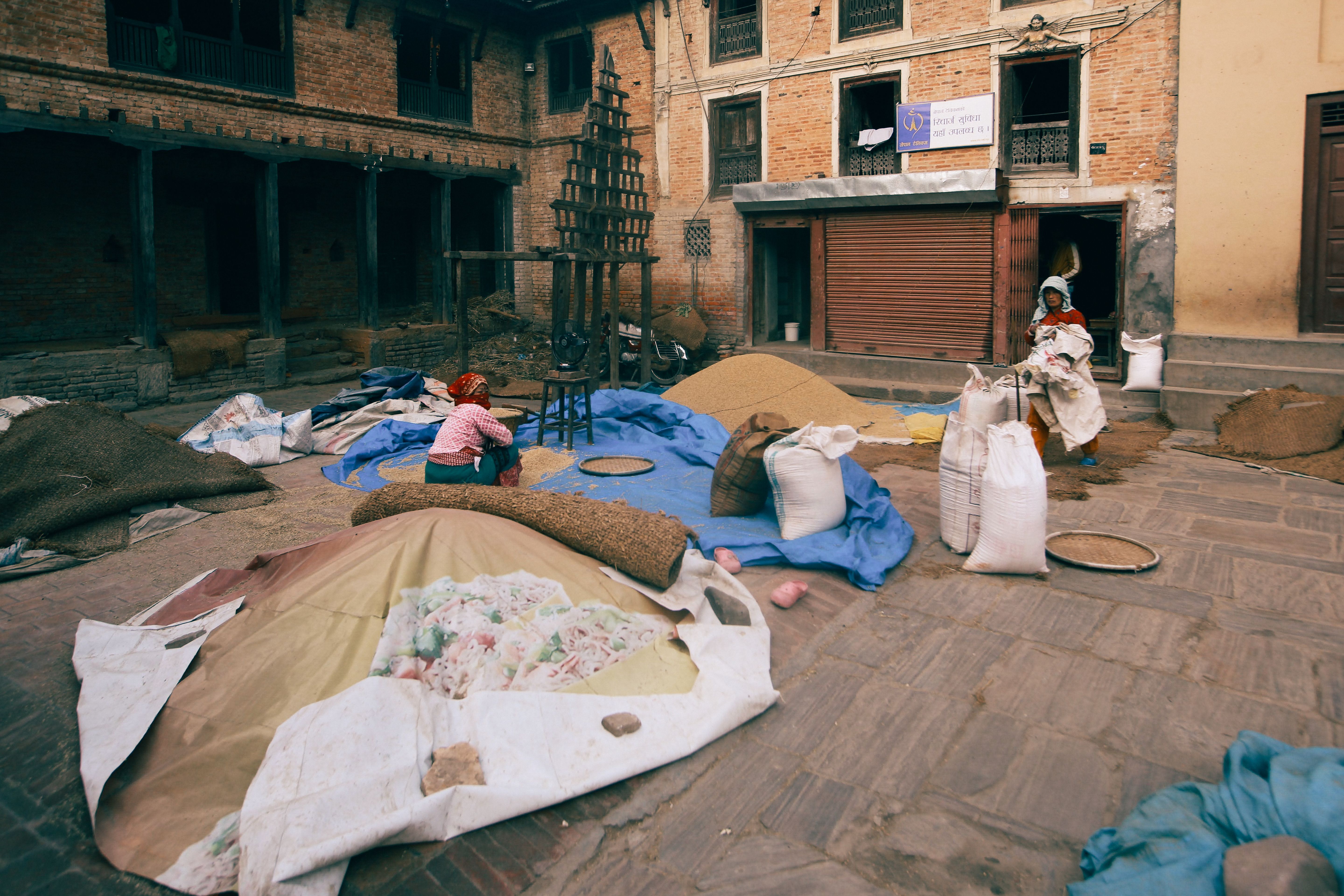 People Working in Buildings Courtyard · Free Stock Photo