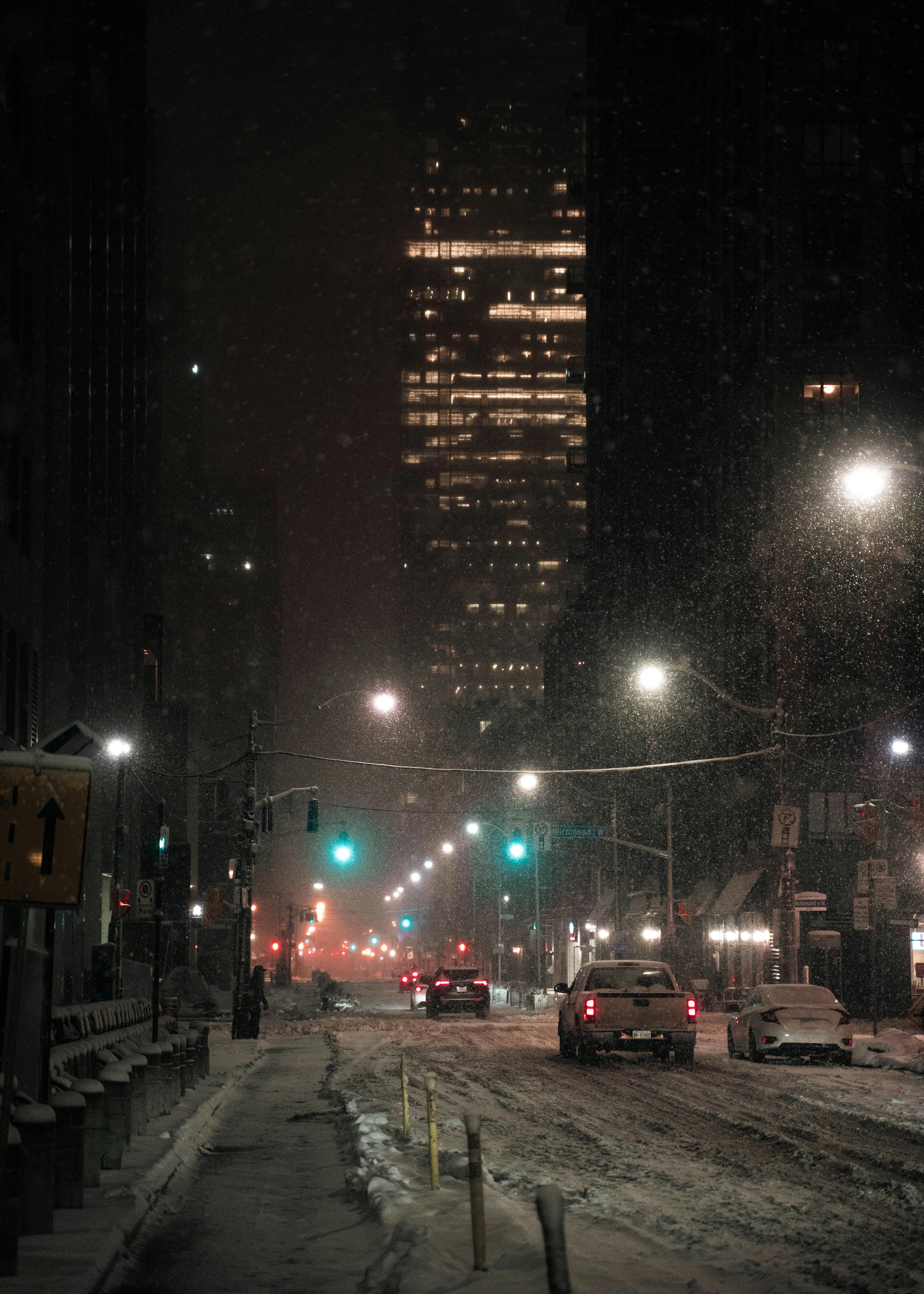 Cars Driving on Snowy Road at Night · Free Stock Photo