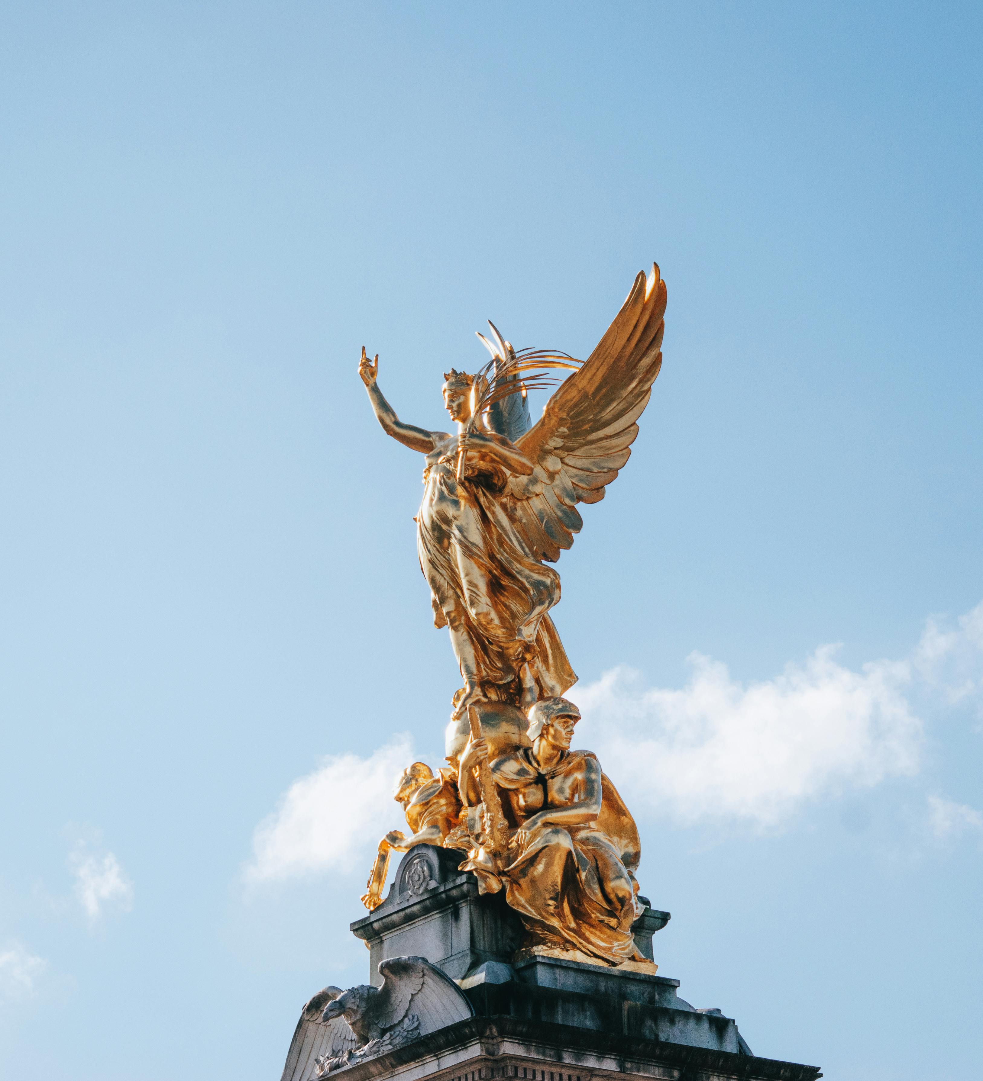 A Gold Angel Statue Under Blue Sky · Free Stock Photo