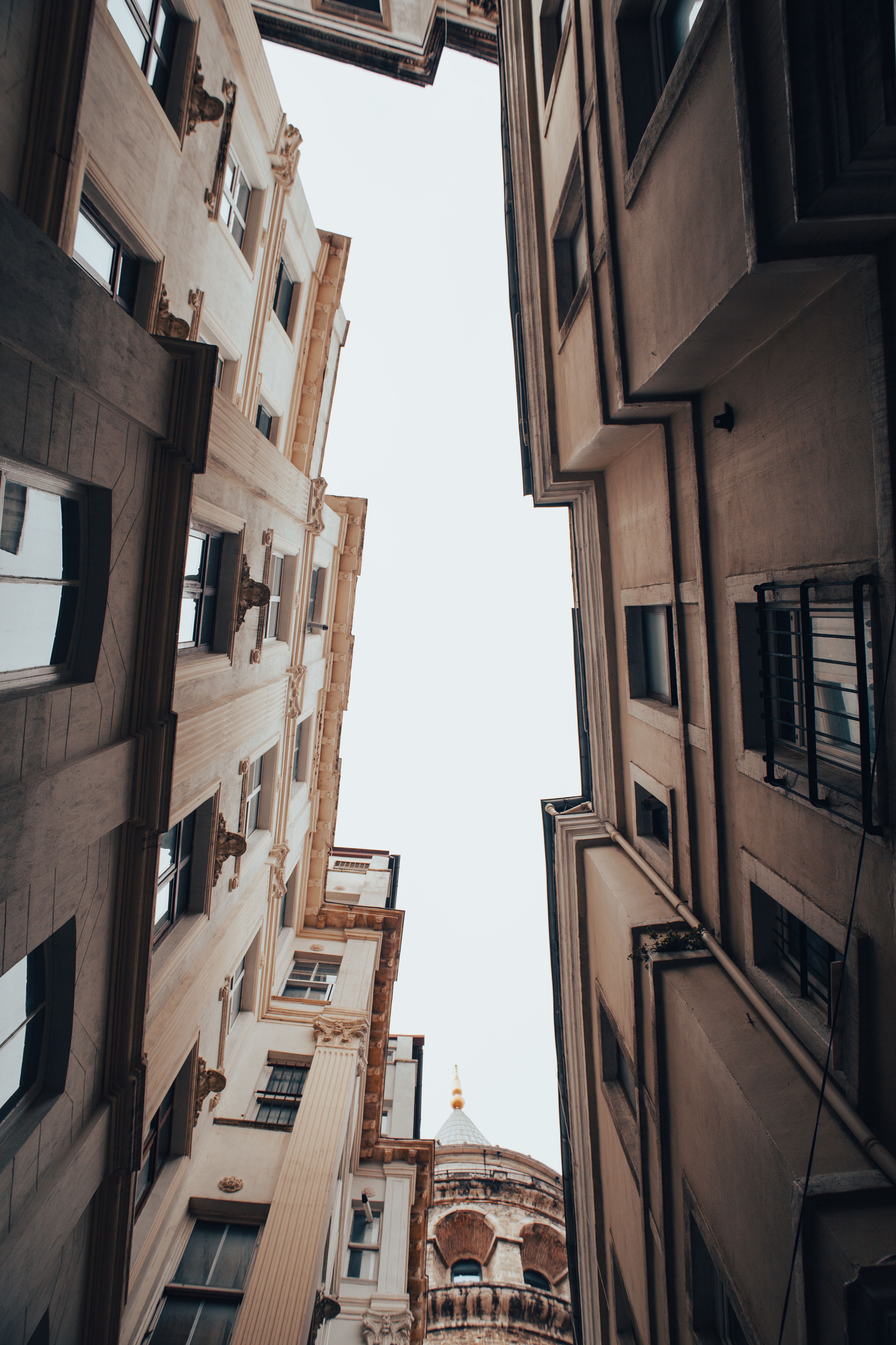 A Low Shot Angle of a Brown Concrete Building · Free Stock Photo
