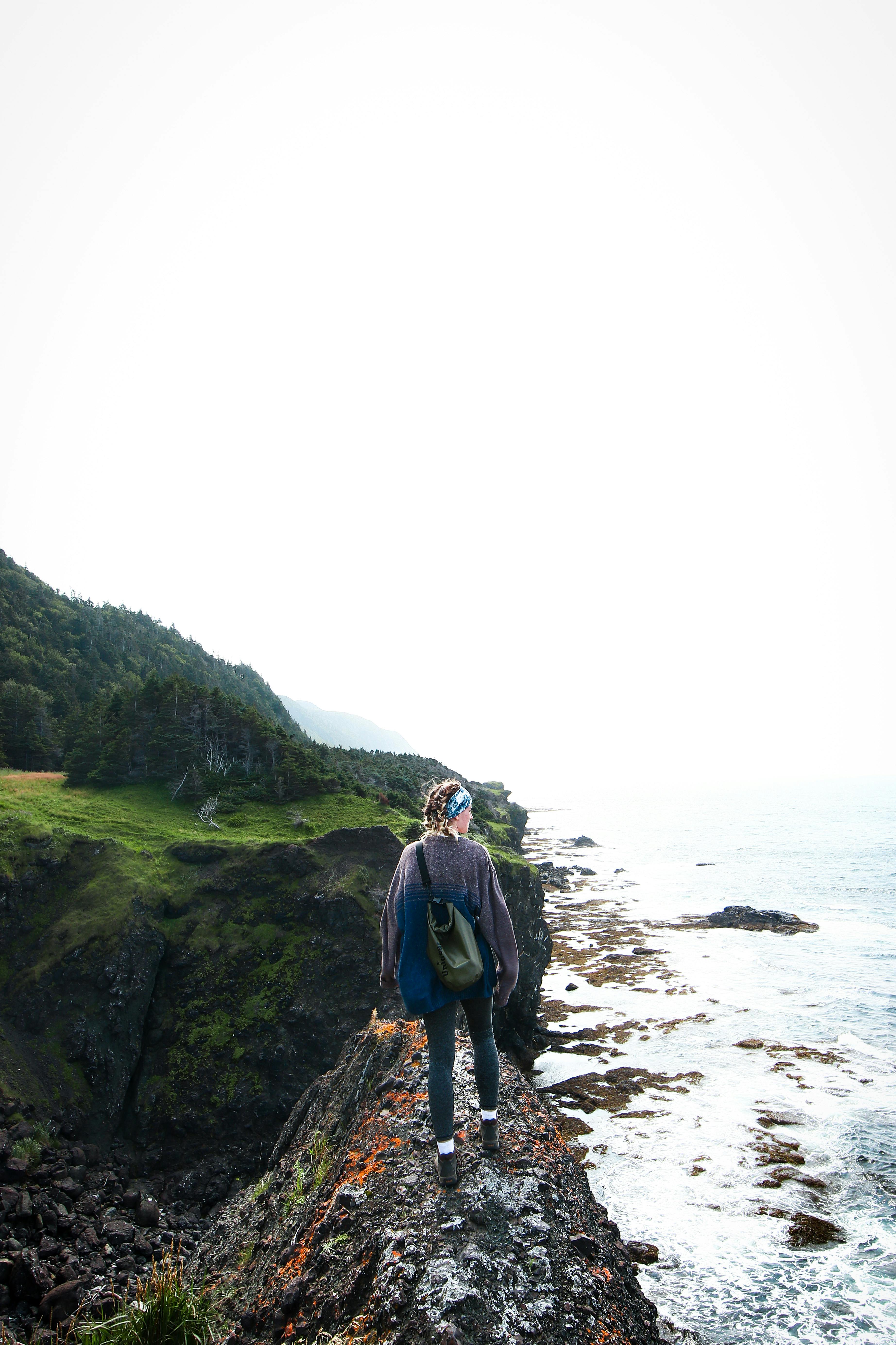 Woman Walking on a Cliff · Free Stock Photo