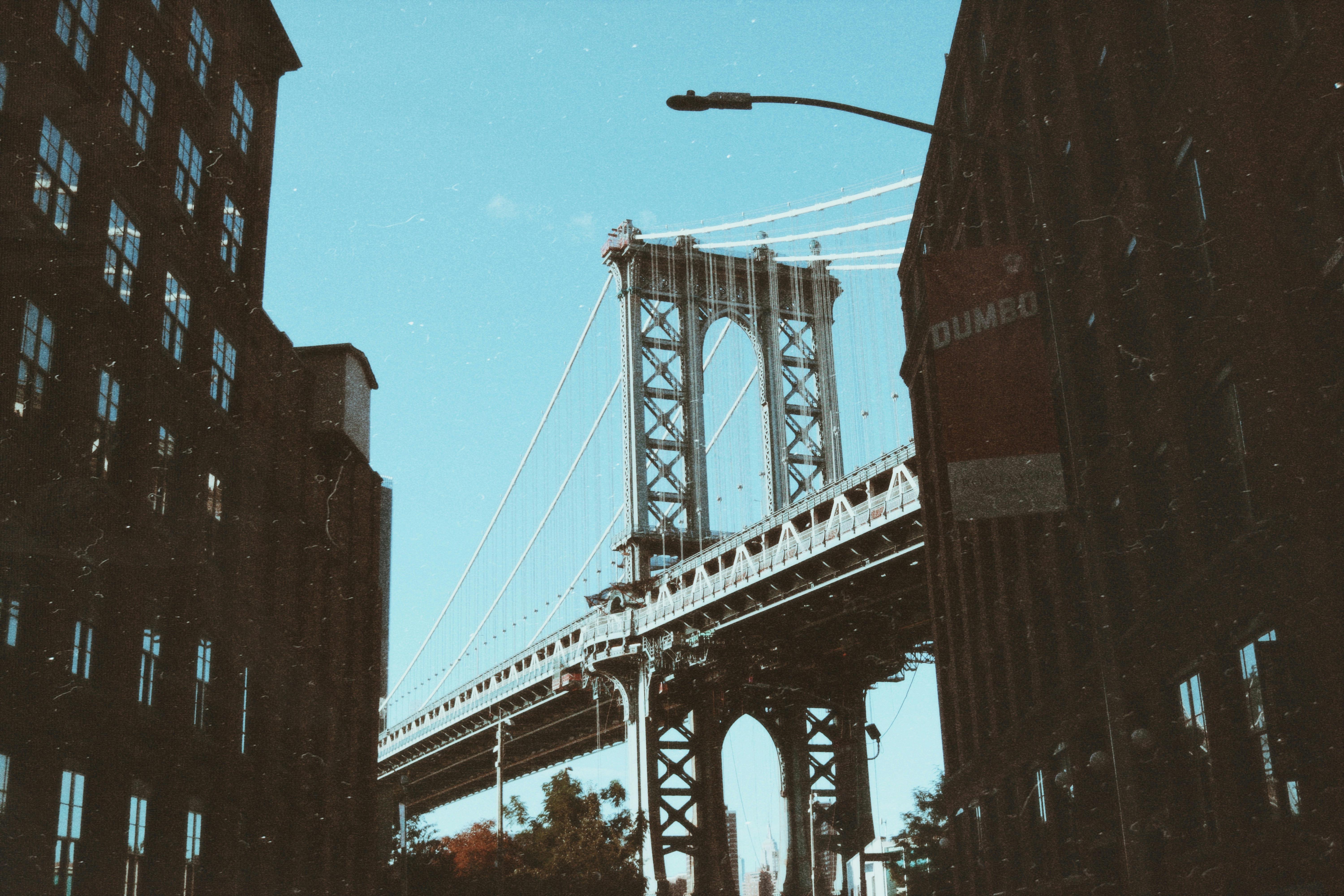 Brooklyn Bridge Seen Between Buildings · Free Stock Photo