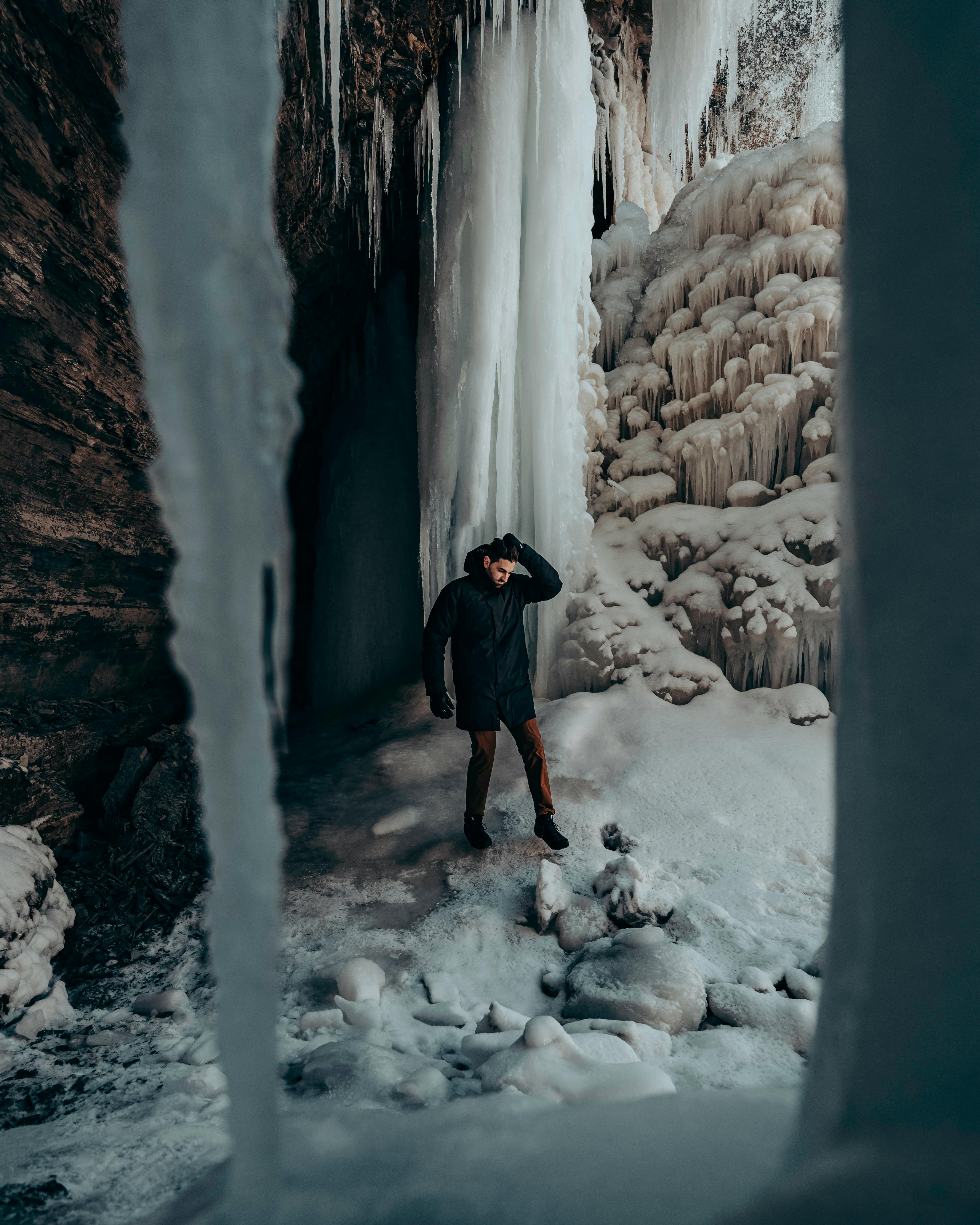 Man Standing around Ice and Snow · Free Stock Photo