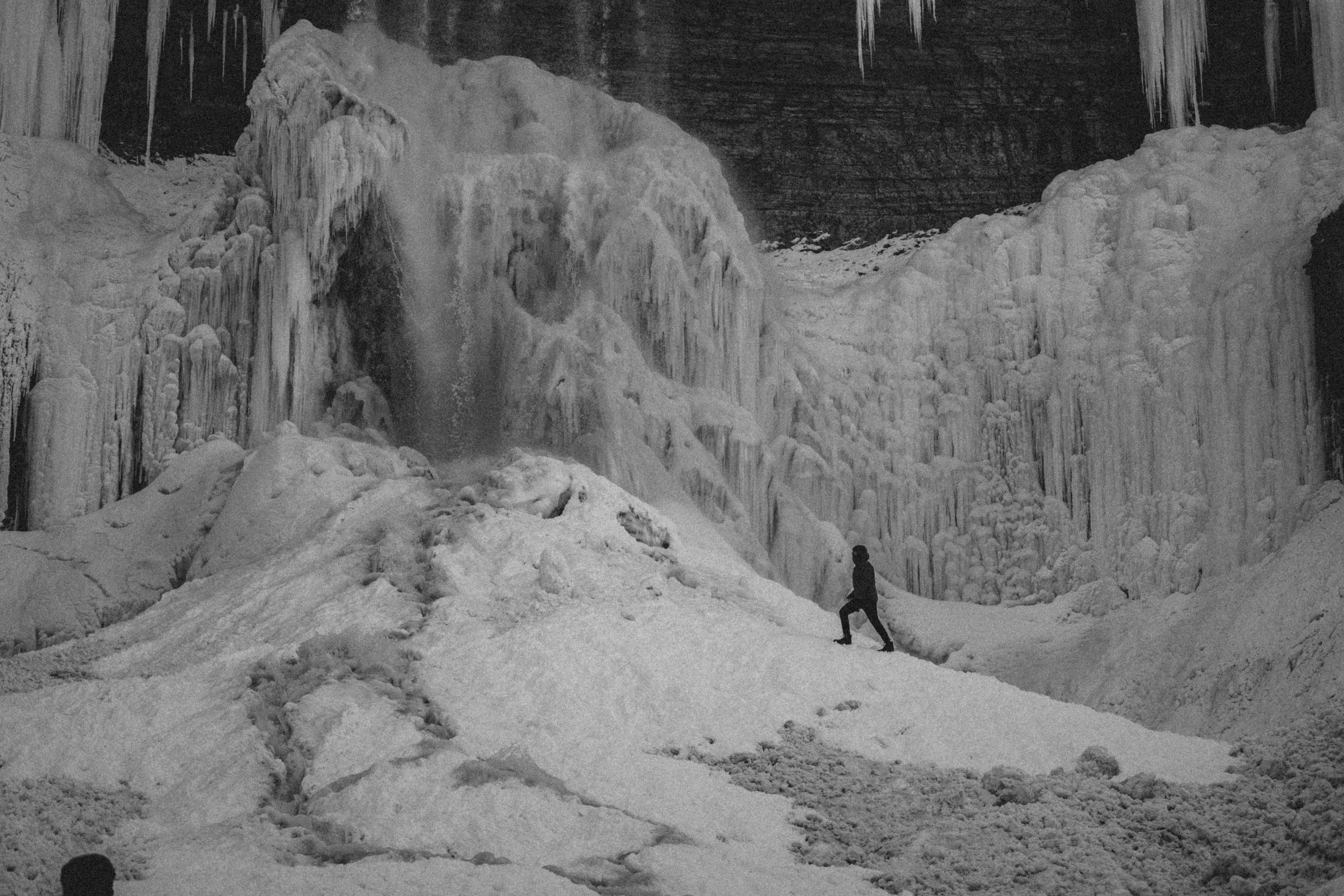 Man in Front of a Frozen Waterfall · Free Stock Photo