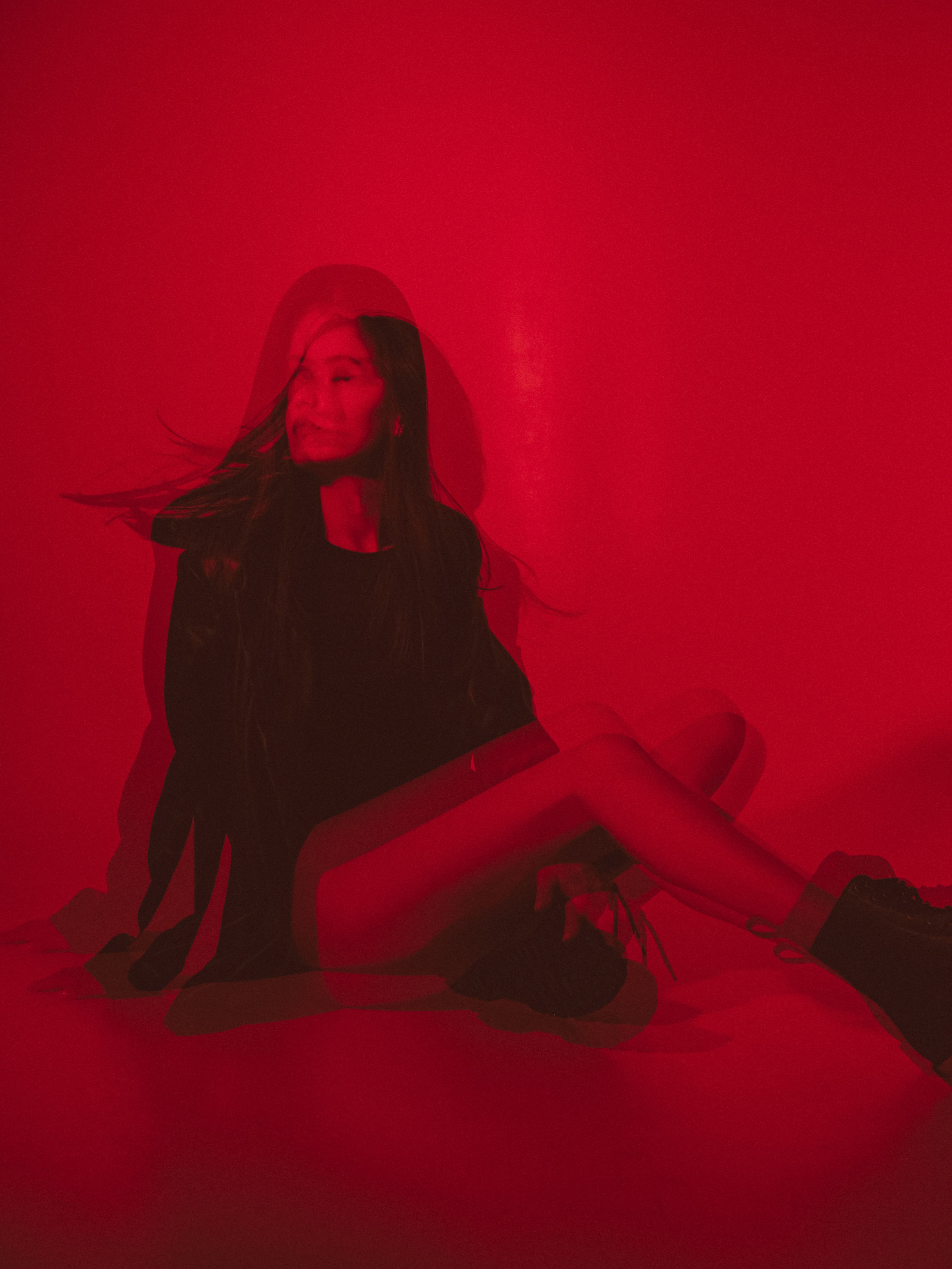 Studio Shot of a Woman in Red Lighting · Free Stock Photo