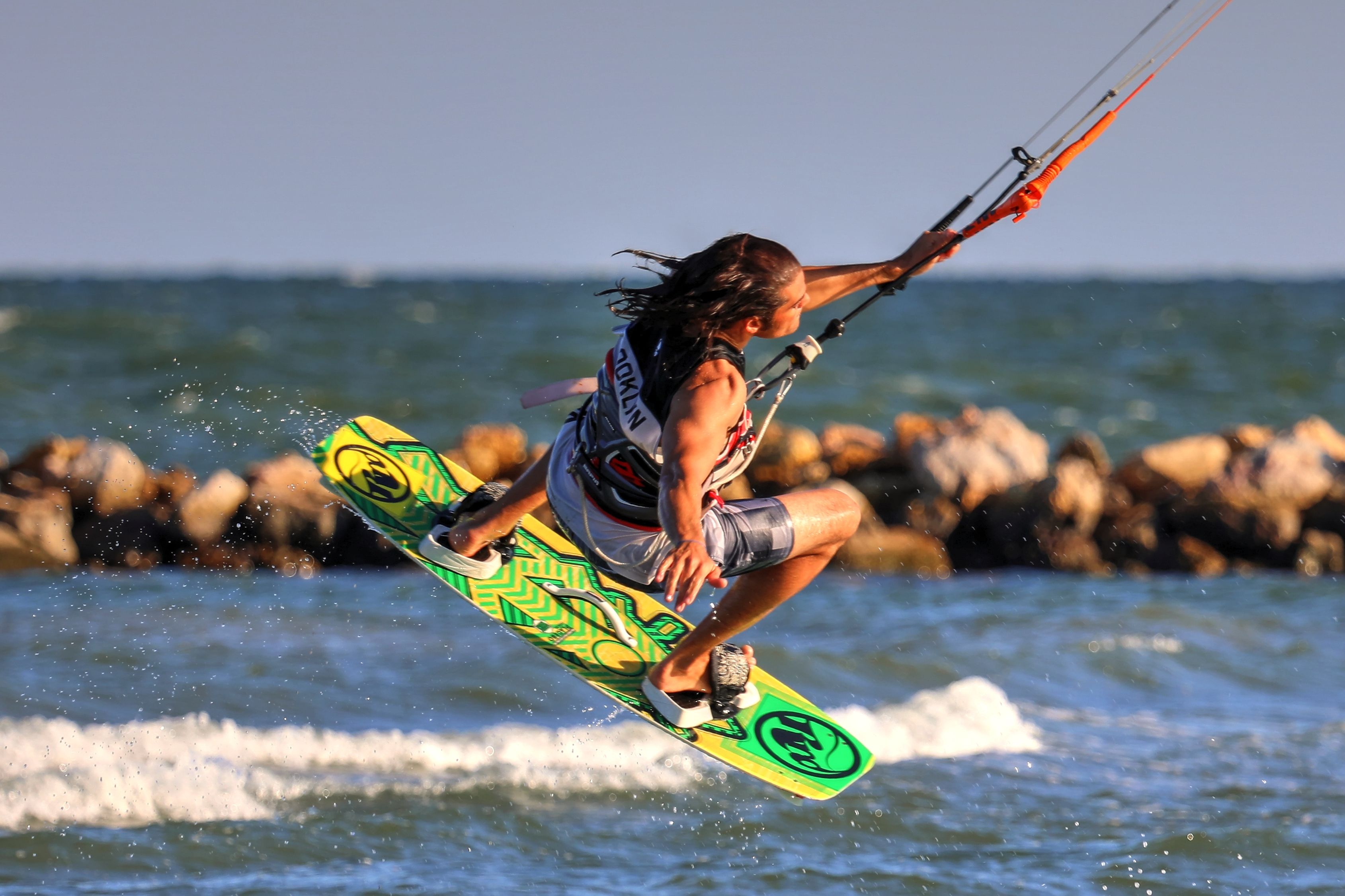 Back View of a Person Midair doing a Trick · Free Stock Photo