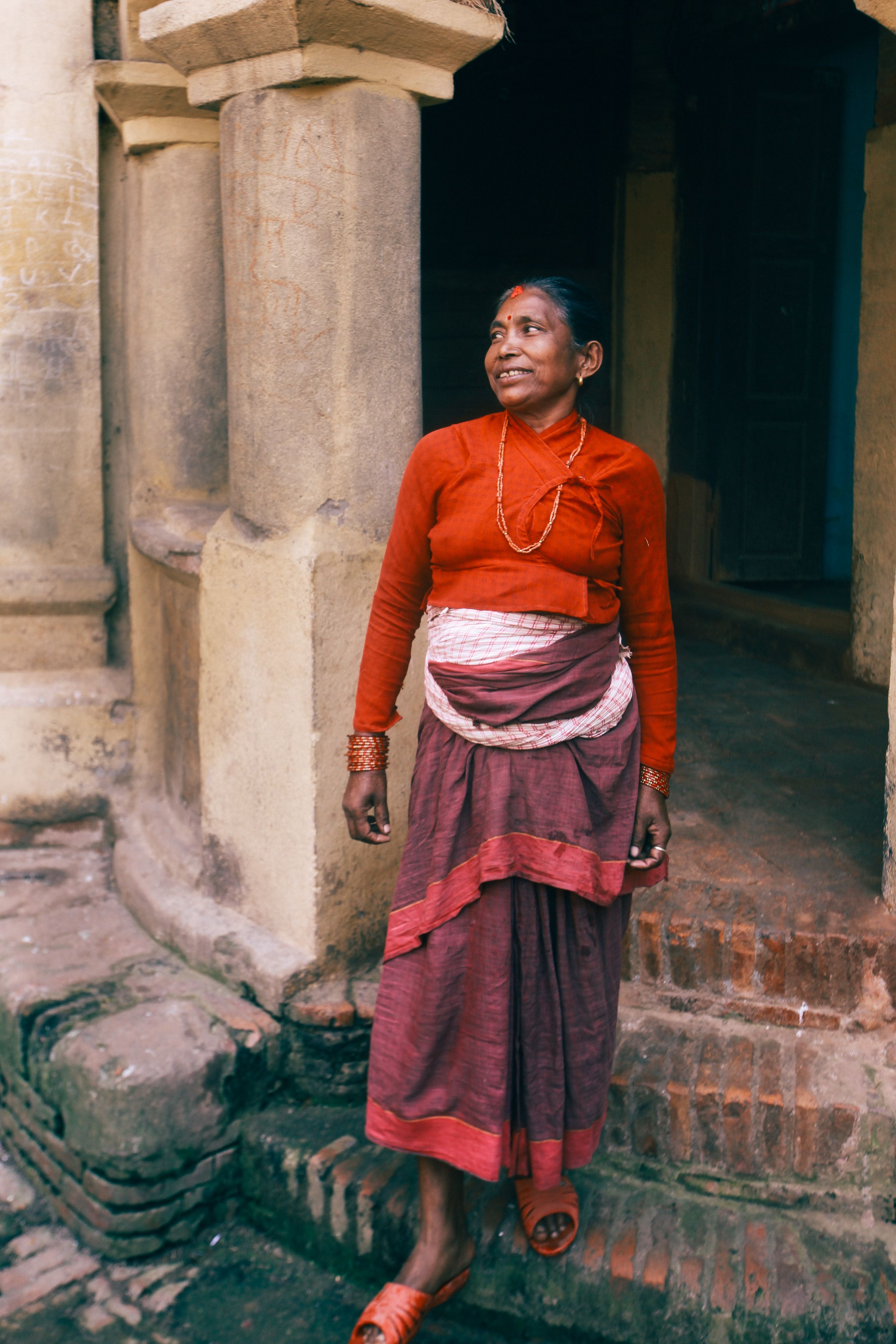 Elderly Woman Carrying a Burden in Traditional Way · Free Stock Photo