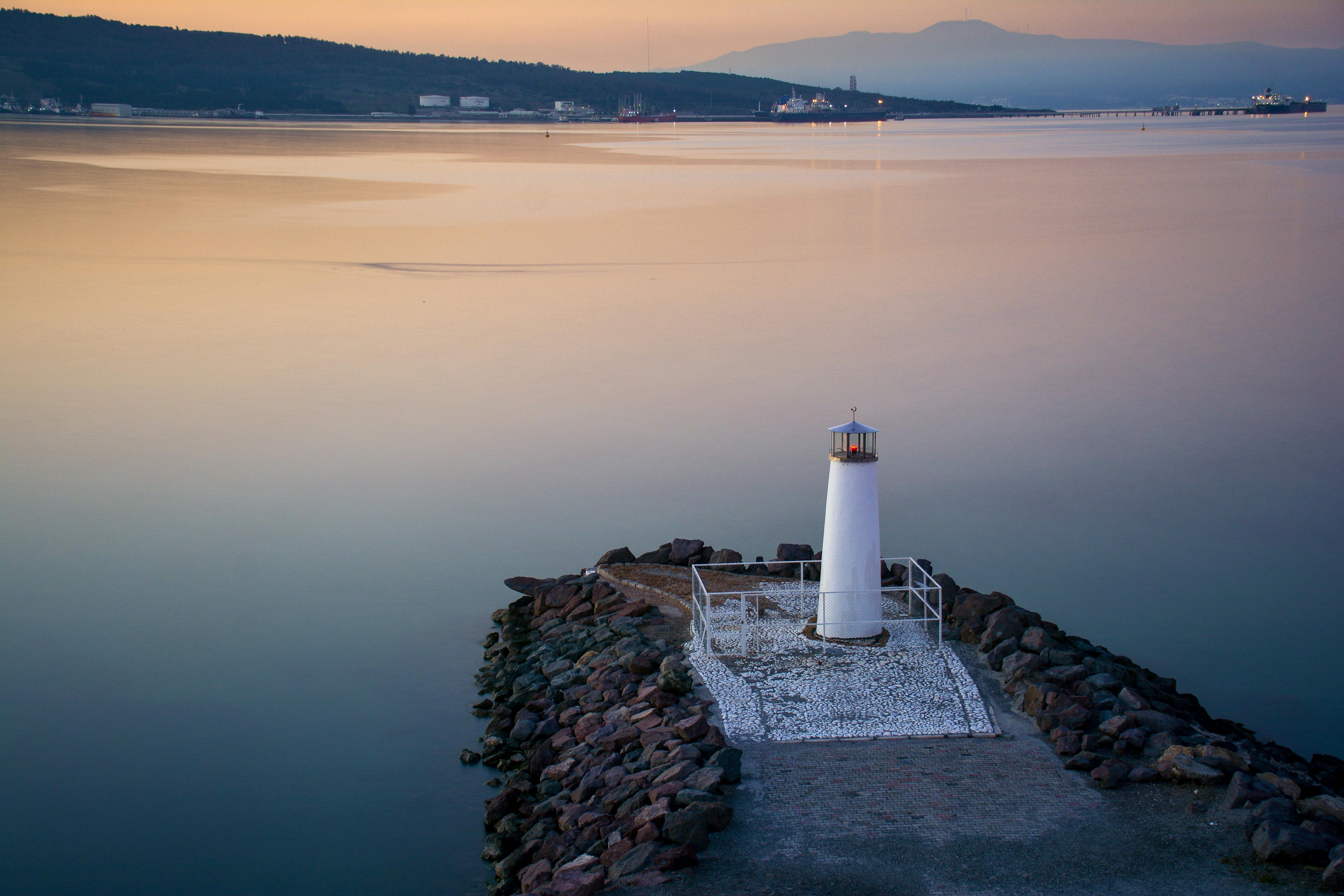 Lighthouse on Shore · Free Stock Photo