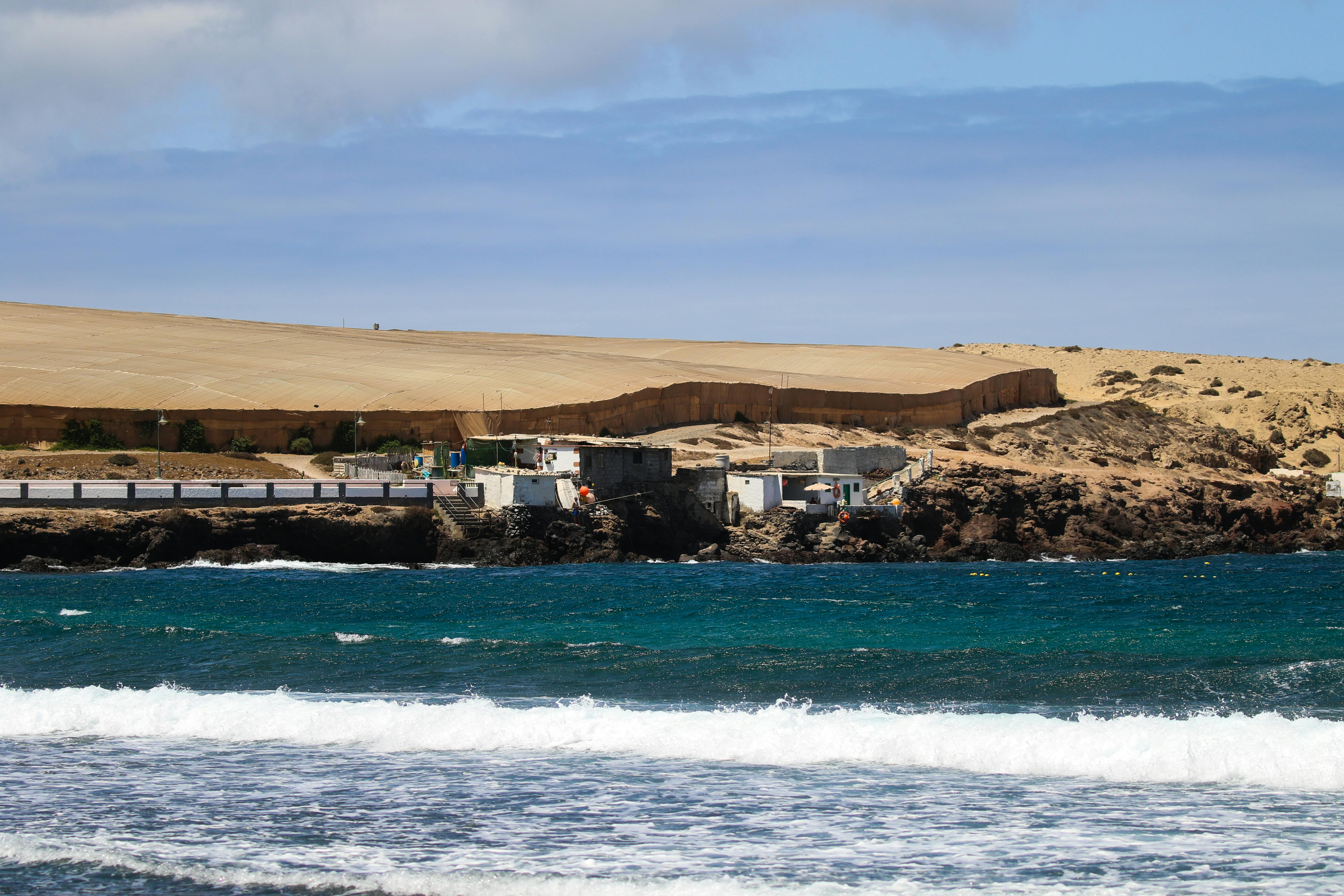 Buildings on Sea Shore · Free Stock Photo