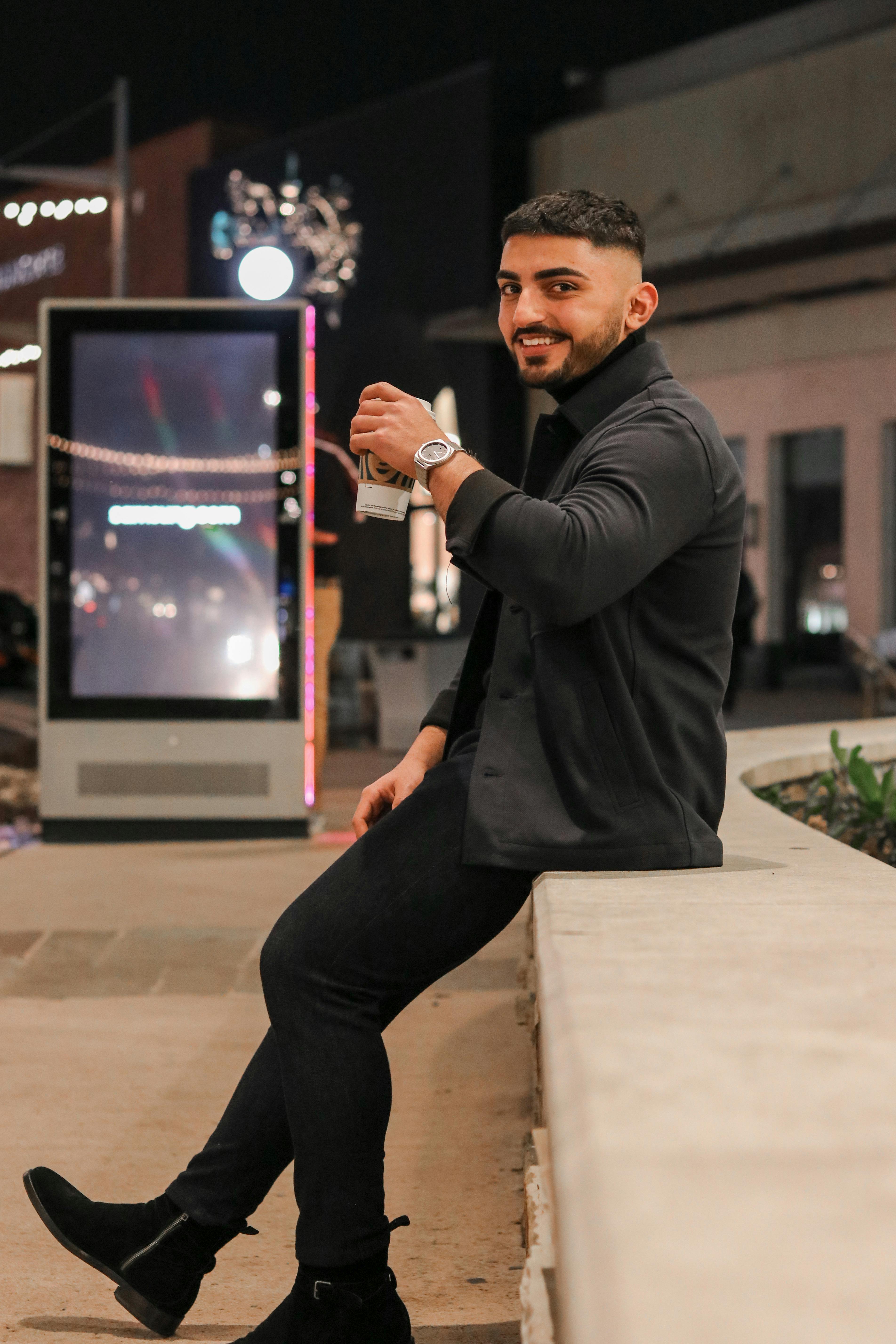 Man Holding a Cup of Drink · Free Stock Photo