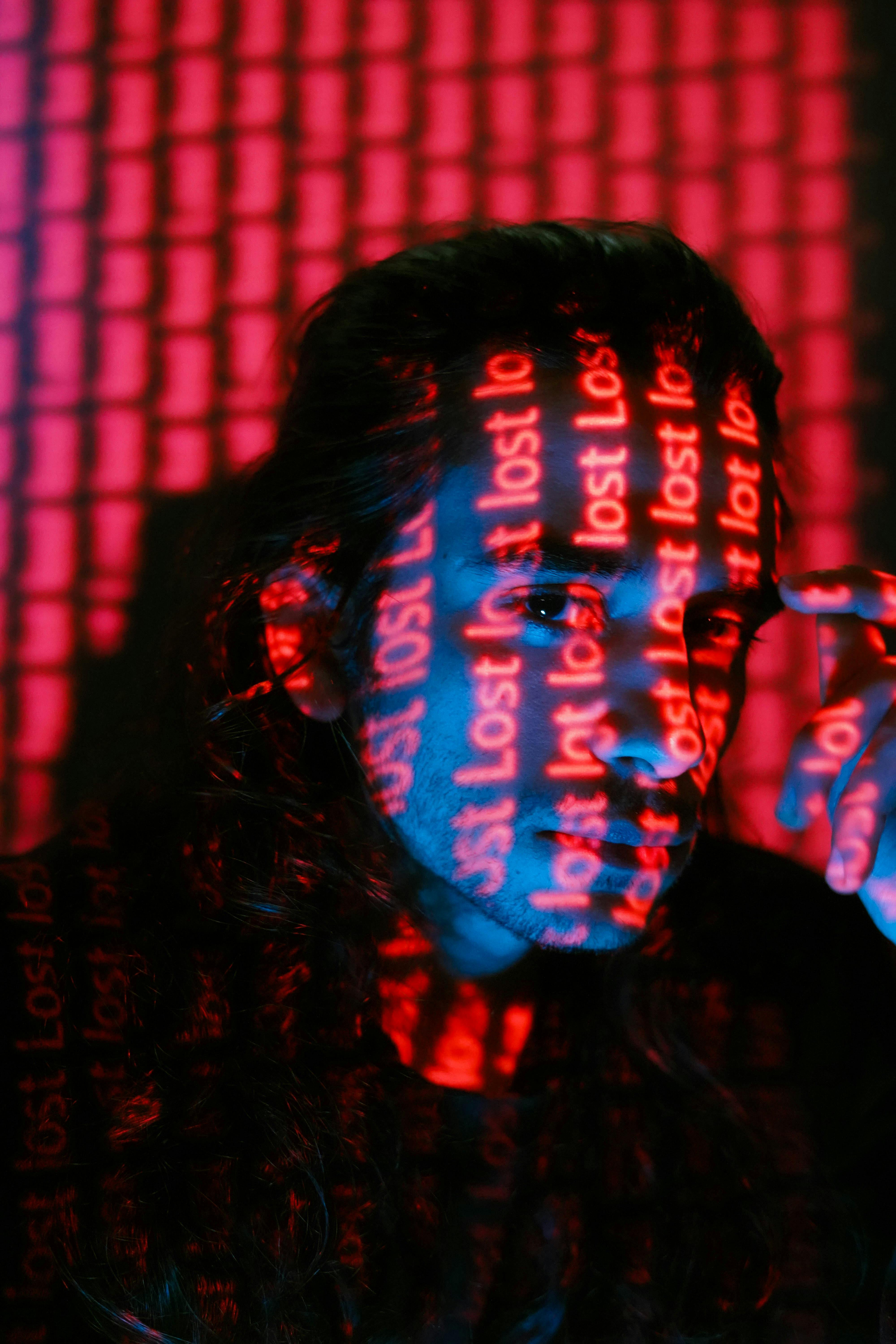 Words Projected on a Wall and a Mans Face · Free Stock Photo