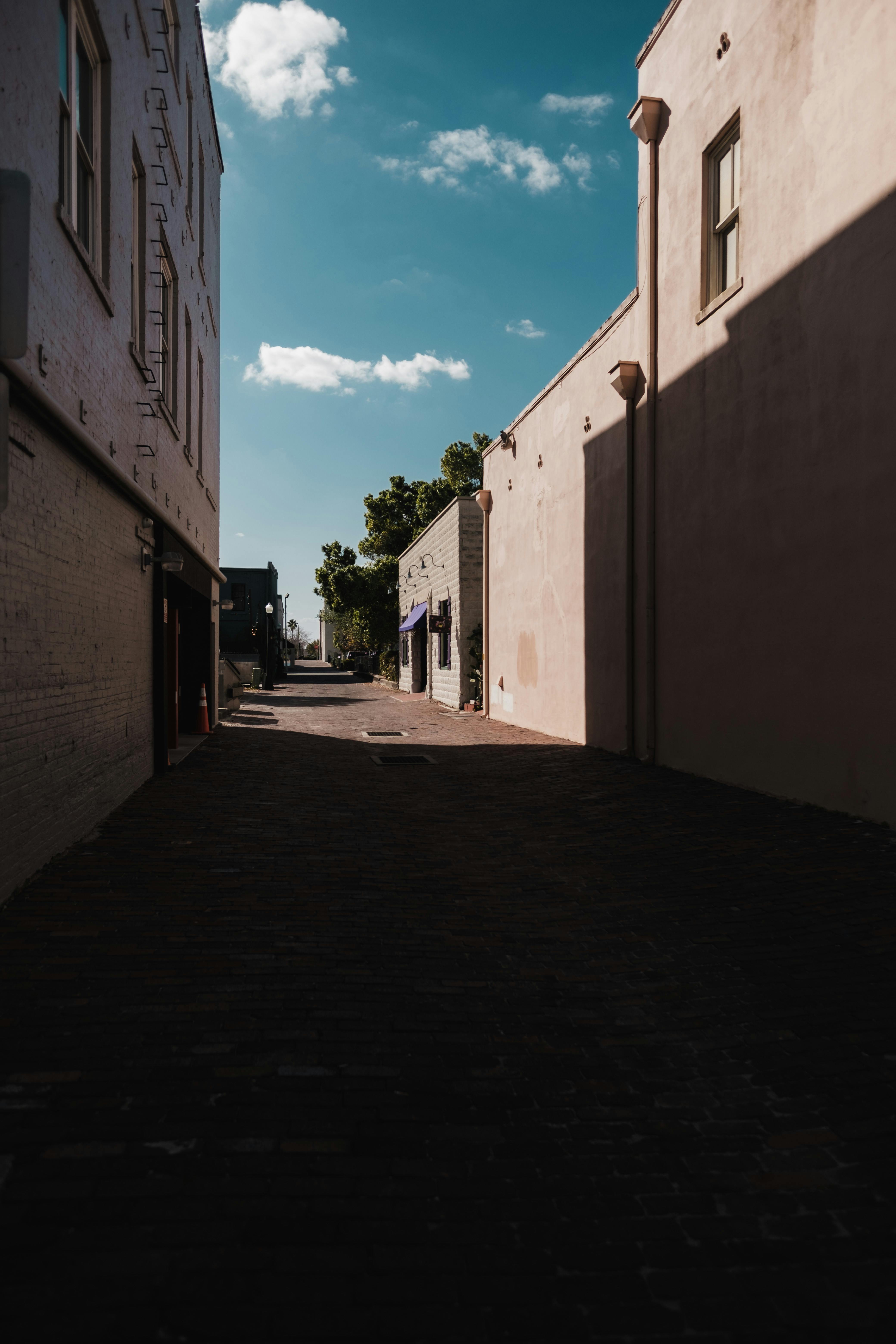 Photo of Empty Alley in Between Buildings · Free Stock Photo