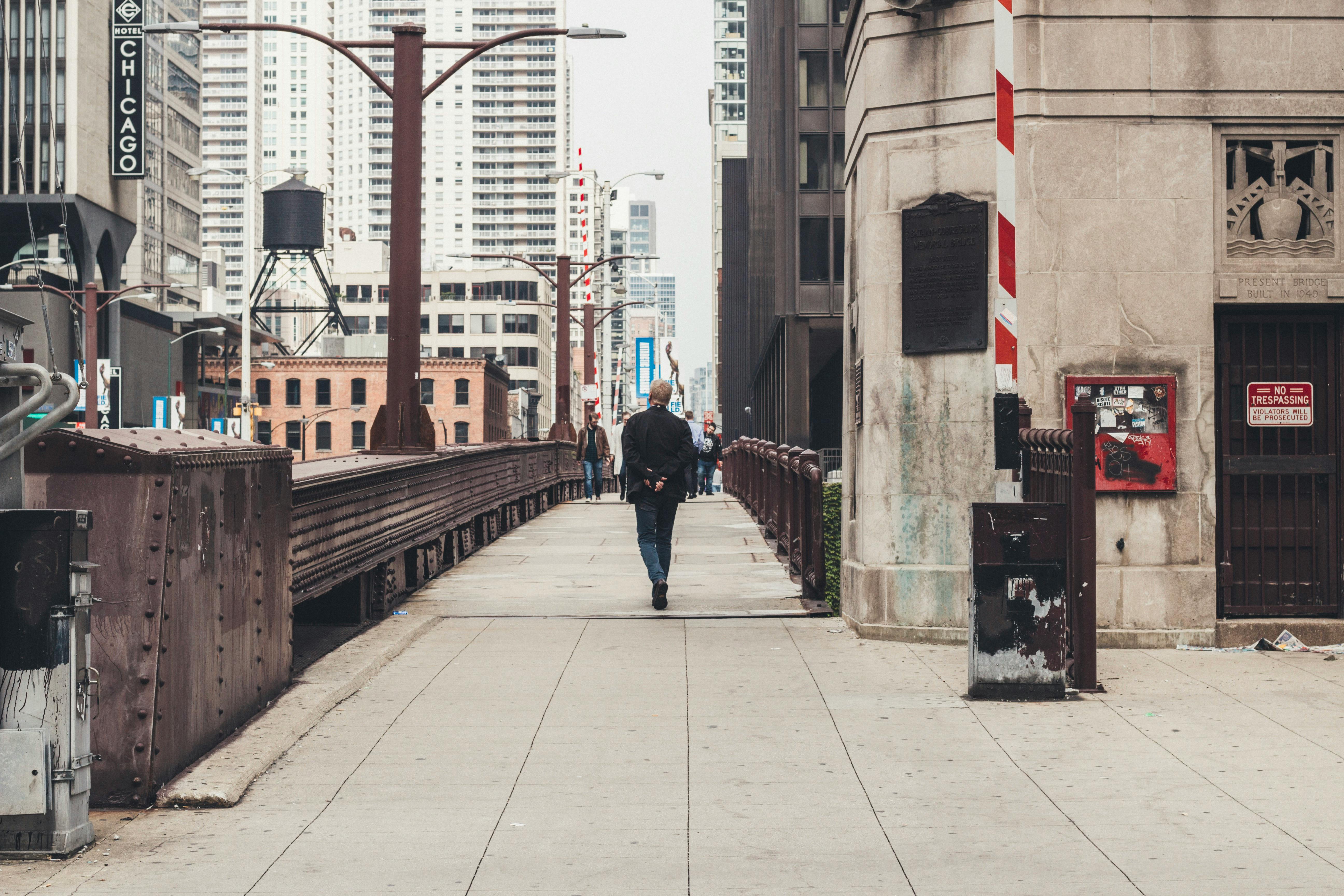 People Walking on a Bridge in a City · Free Stock Photo