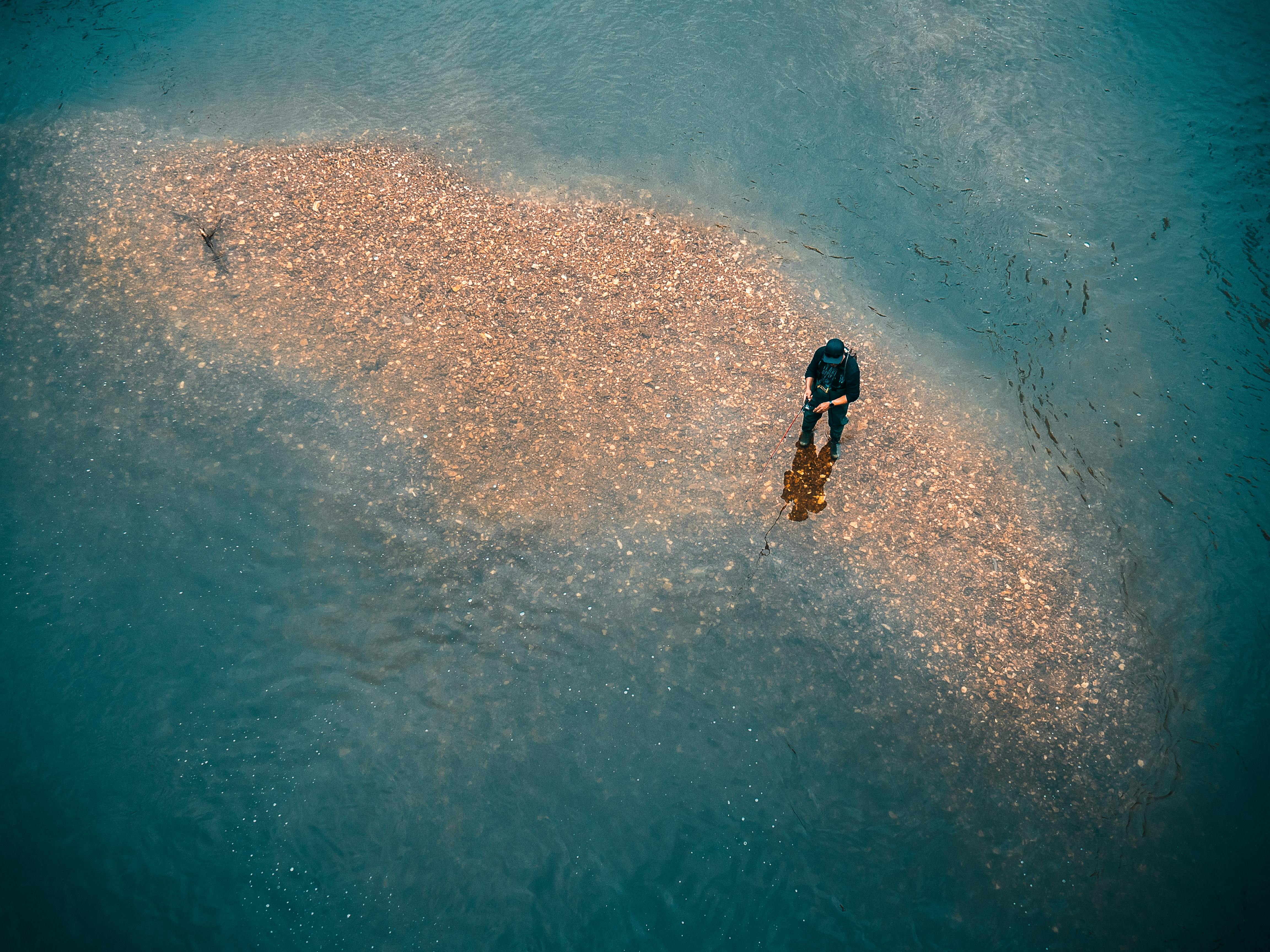 Man Wearing Black Top in Body of Water · Free Stock Photo