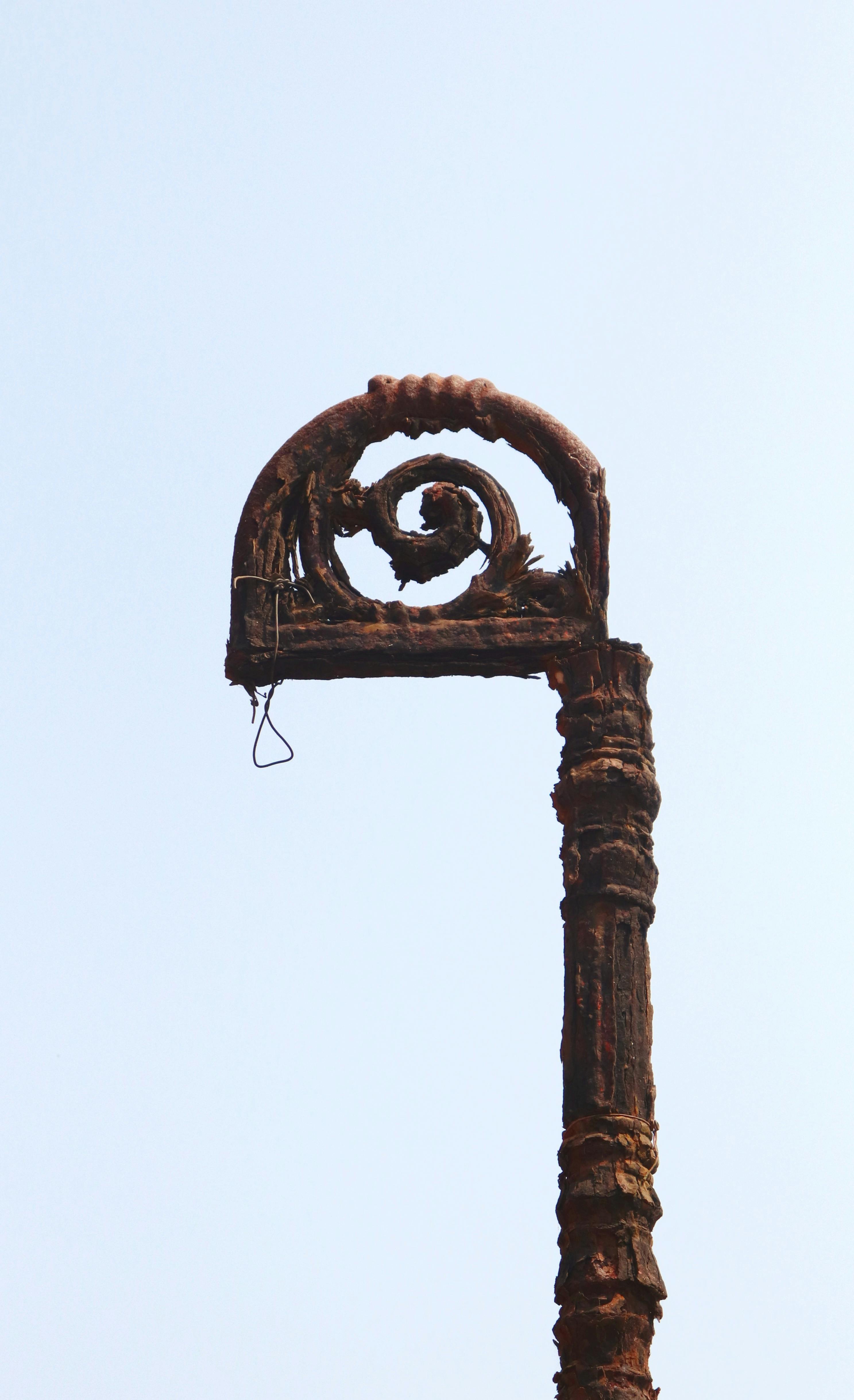 A Rusty Post Under Blue Sky · Free Stock Photo