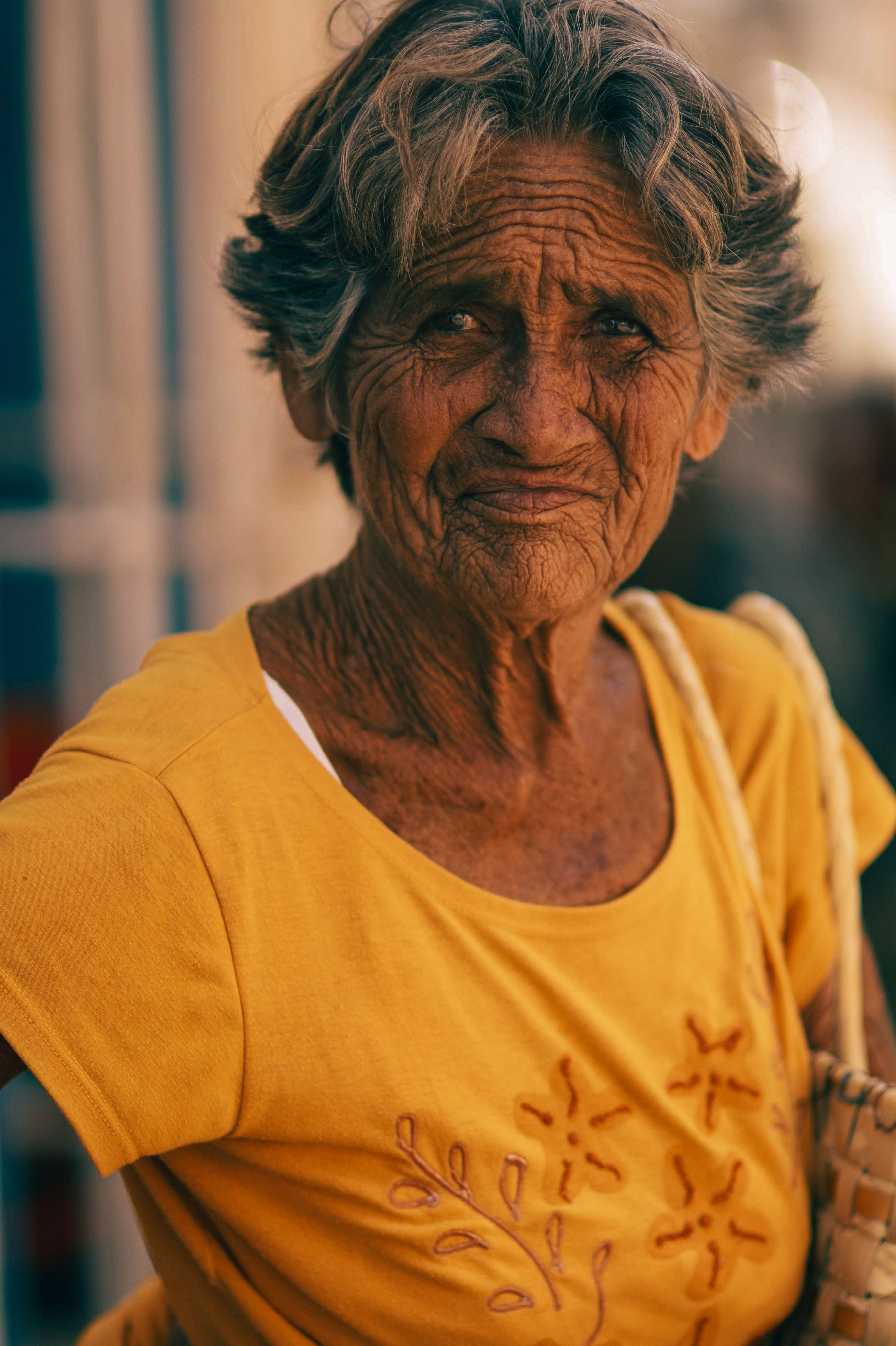 Elderly Woman in Yellow Shirt · Free Stock Photo