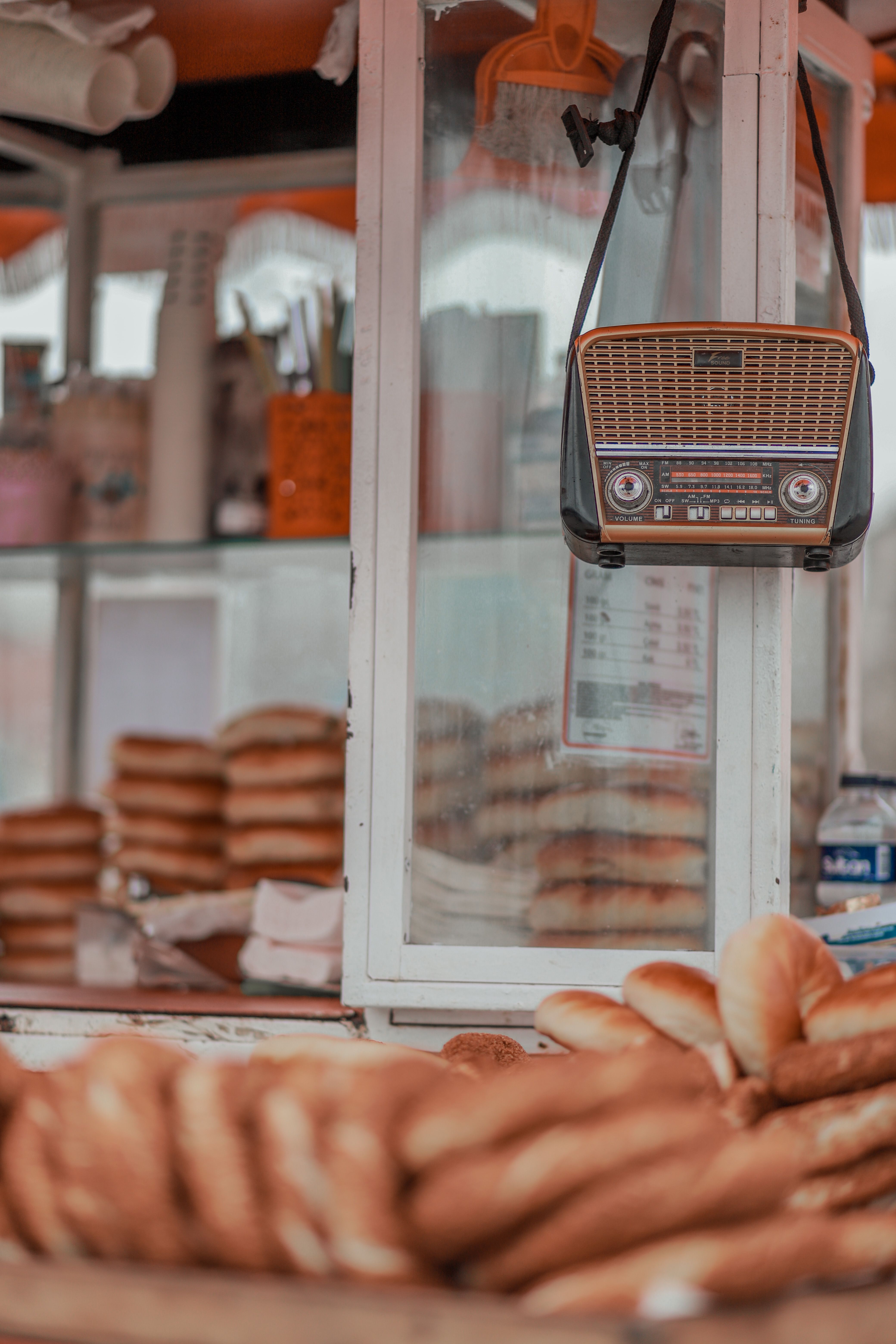 Radio Hanging over Bakery Products · Free Stock Photo