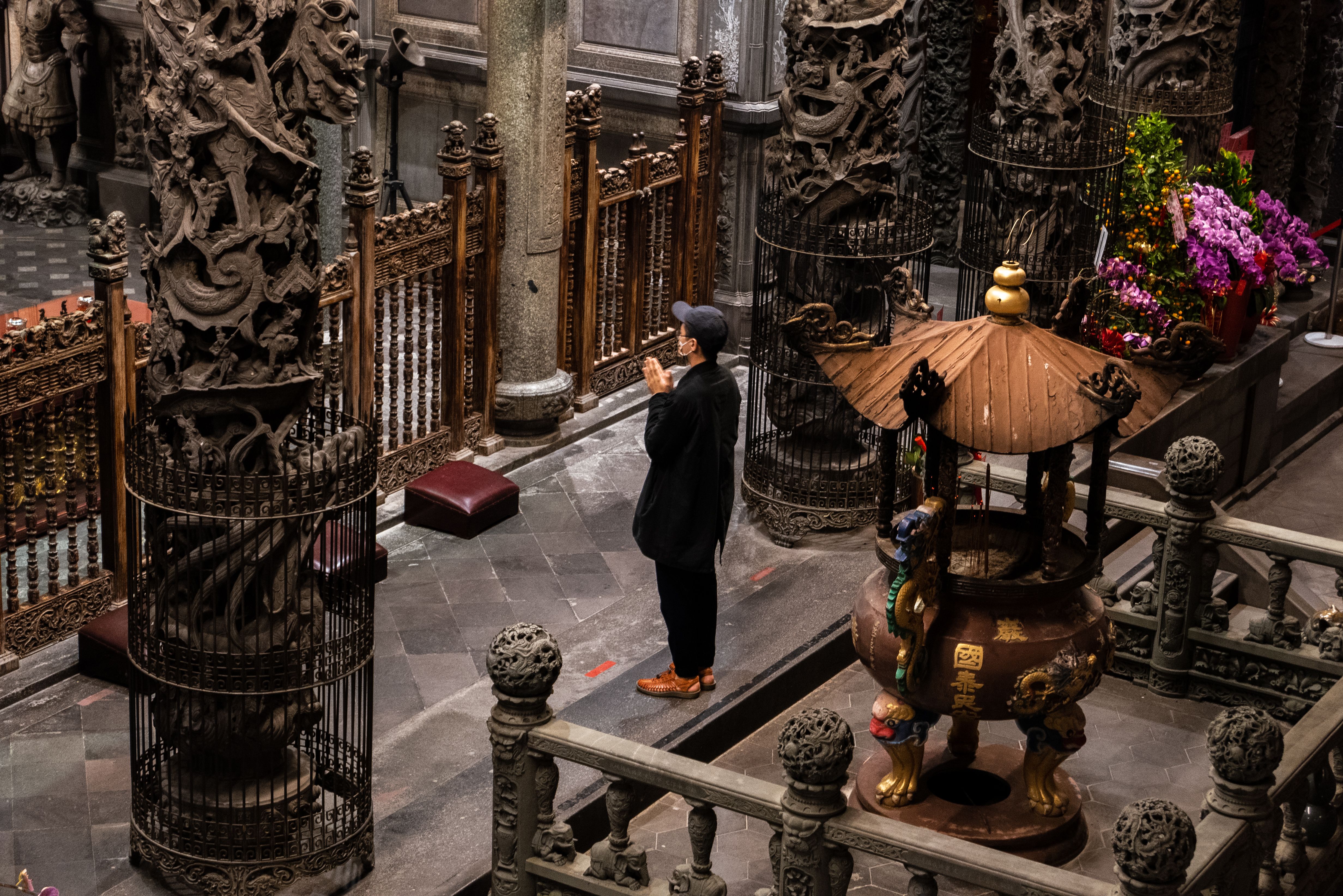 Man Praying in Temple · Free Stock Photo