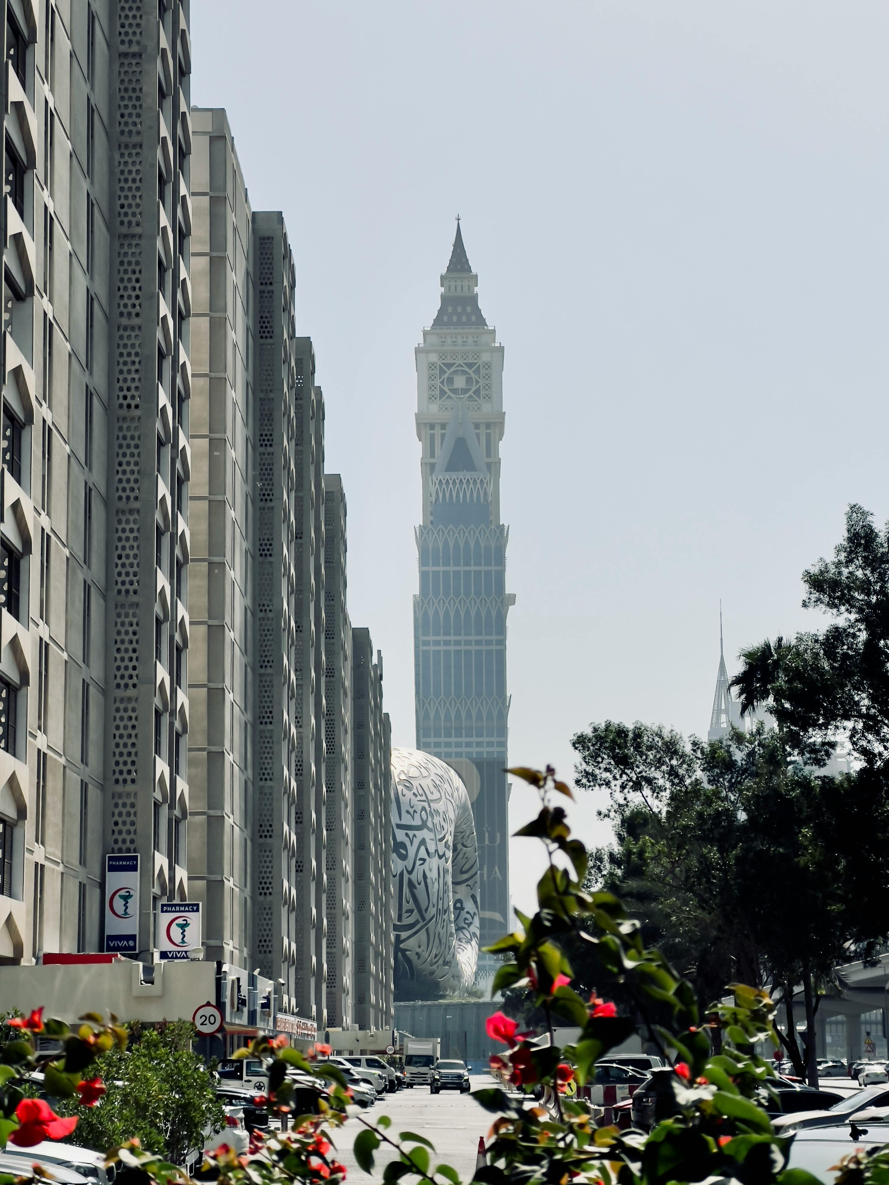 Al Yaqoub Tower Near Museum of the Future Under Blue Sky · Free Stock Photo