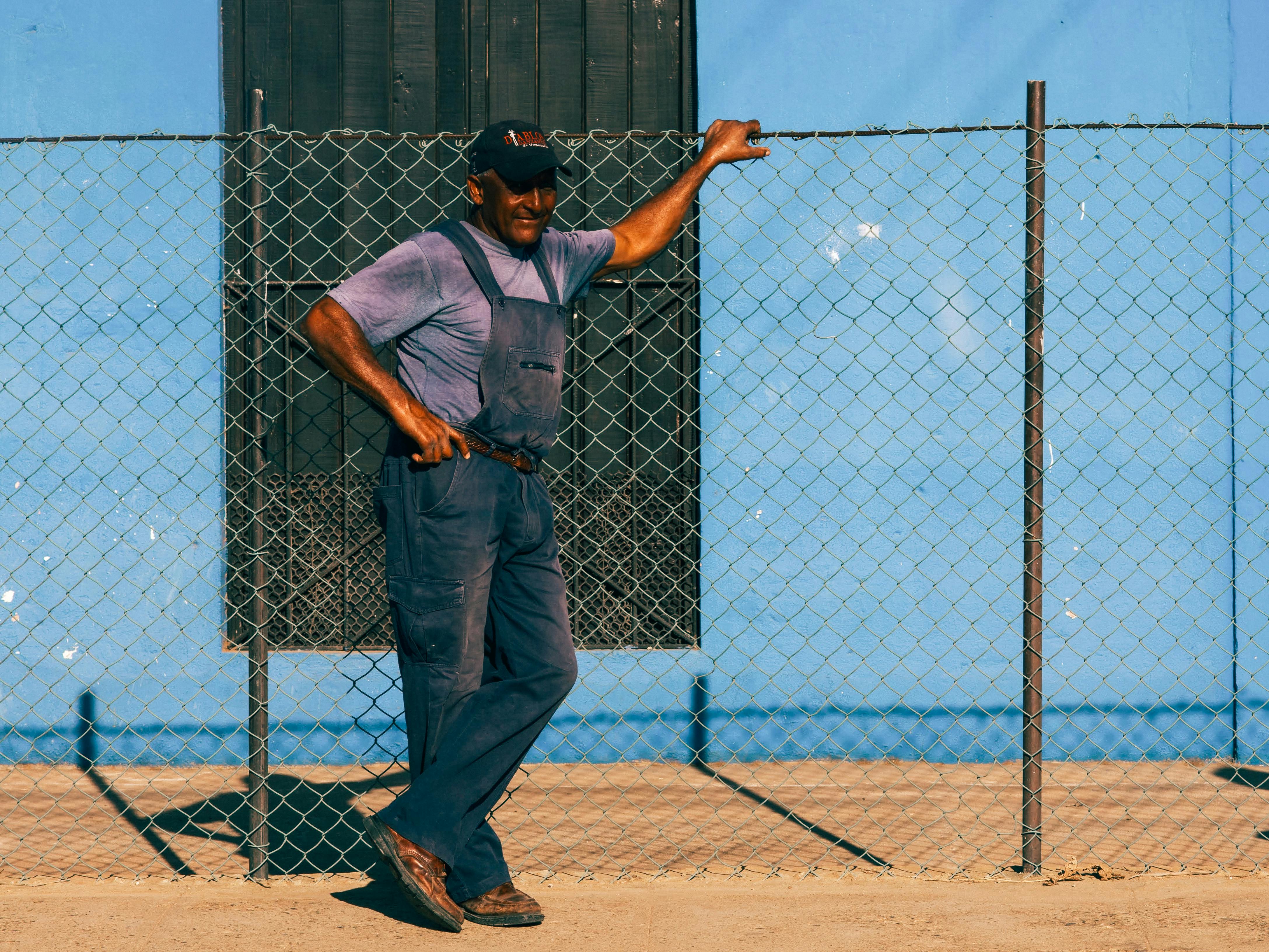 Man Leaning on Post · Free Stock Photo
