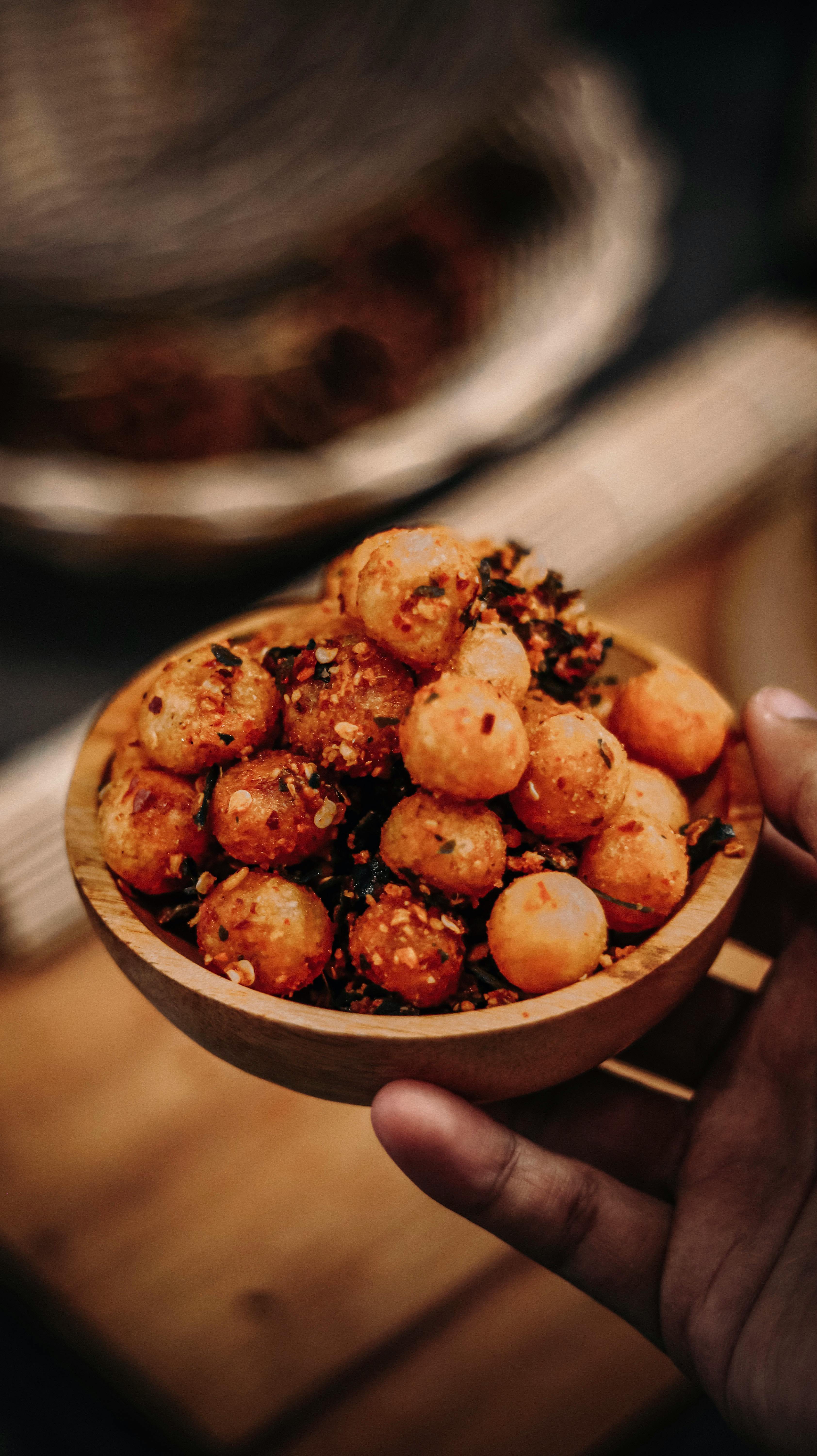 A Set of Fried Ball Shaped Food on a Wooden Bowl · Free Stock Photo