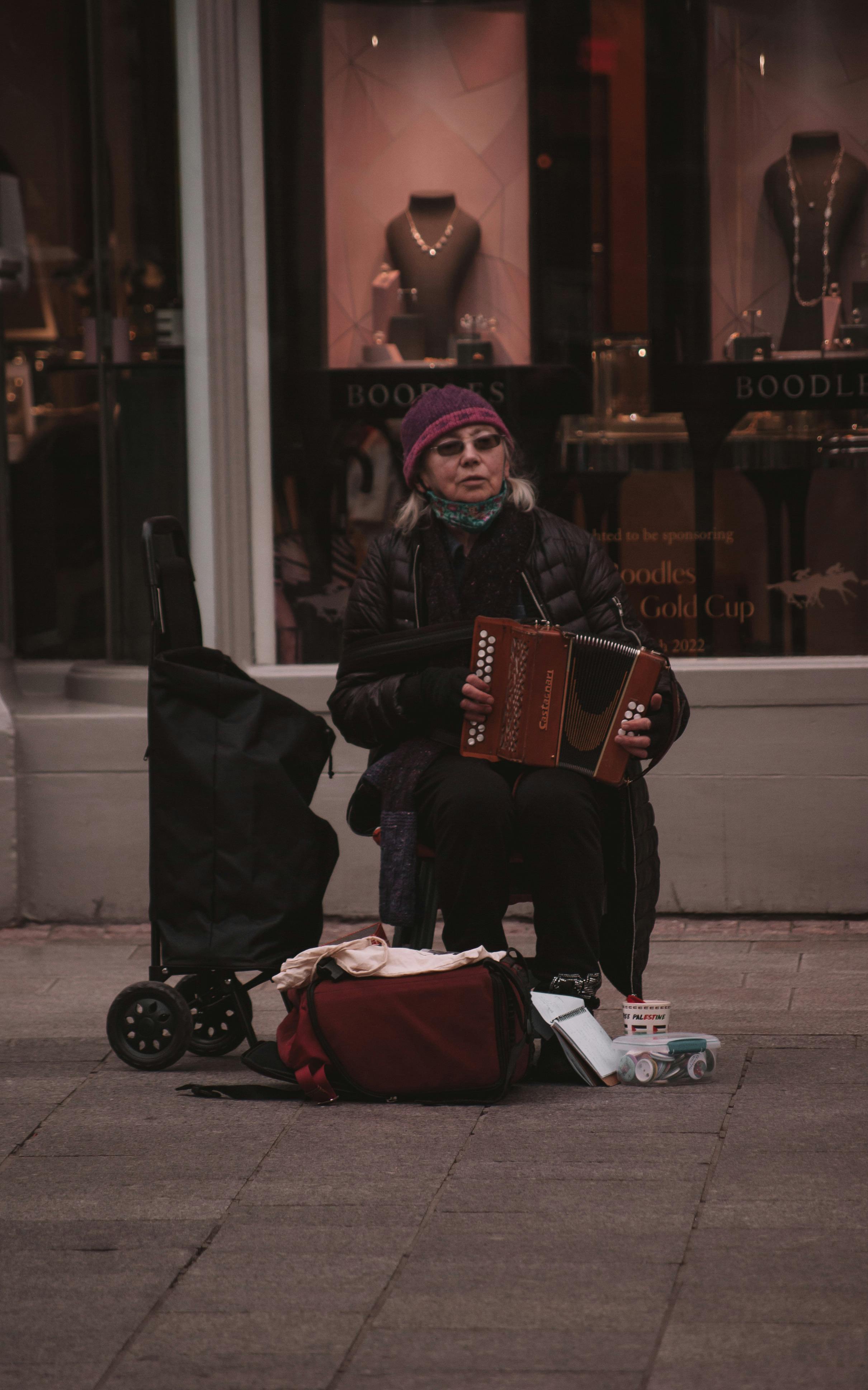 Person Playing a Horner Musical Intrument in Grayscale · Free Stock Photo