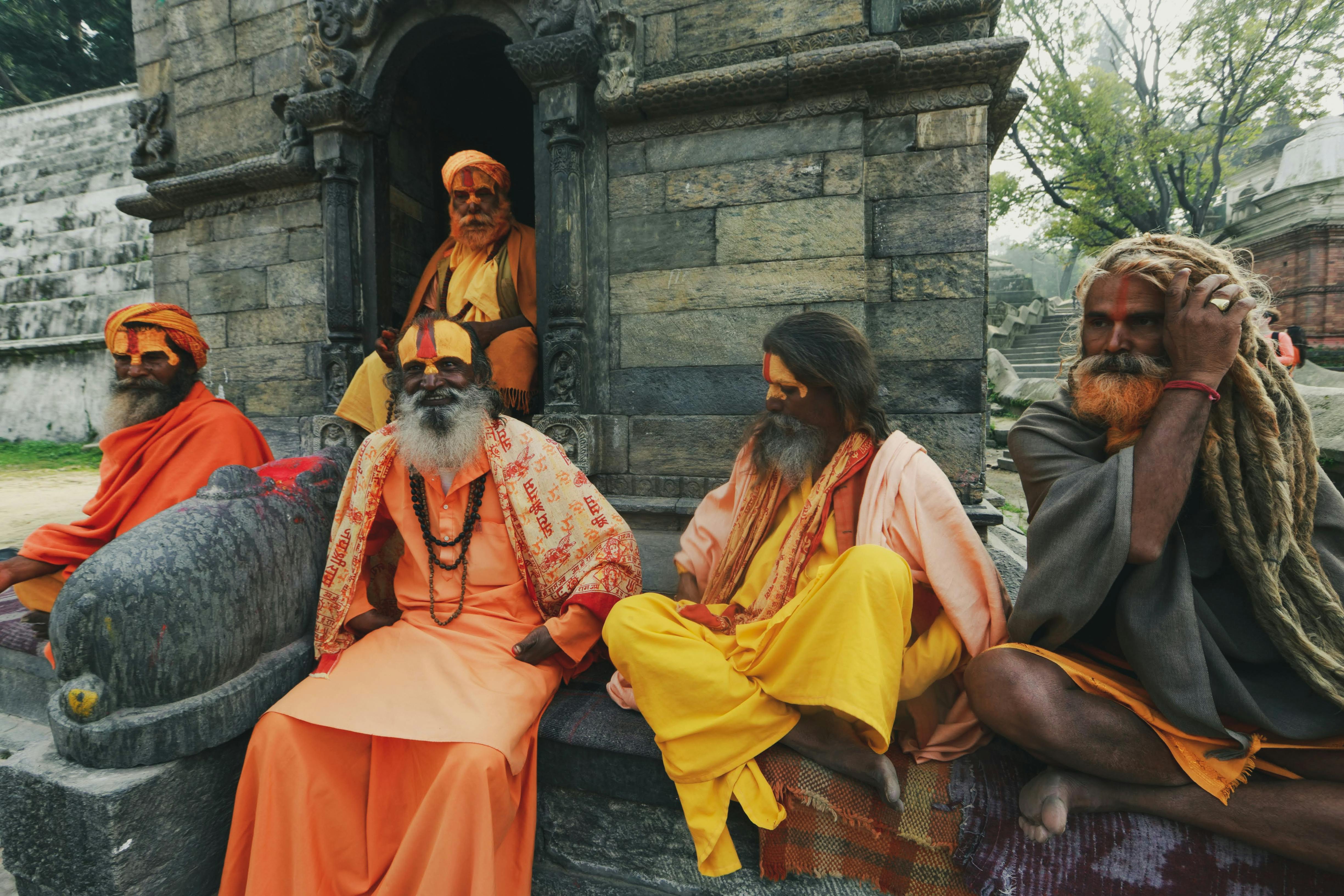 Monks Sitting on Temple Steps · Free Stock Photo
