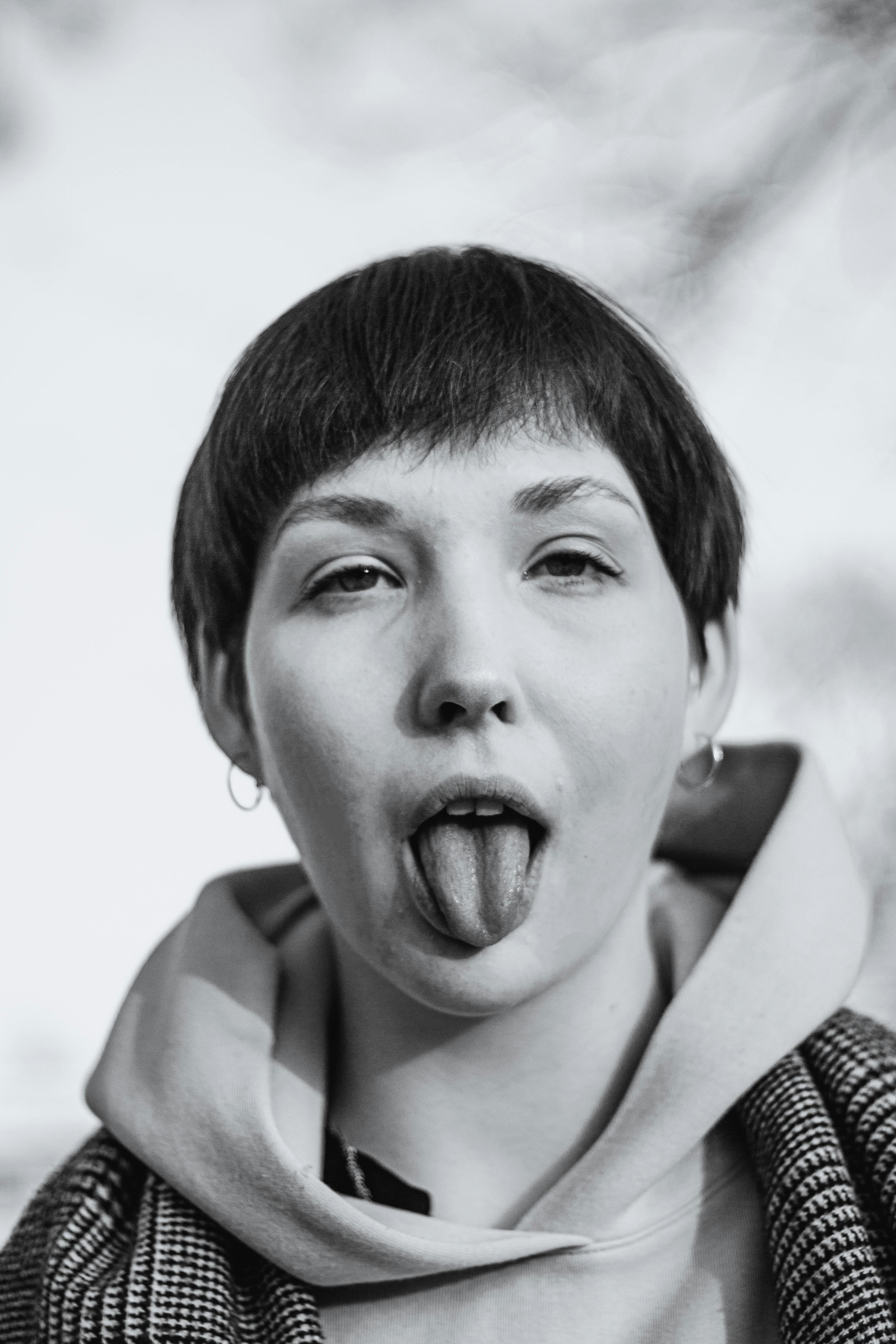 Woman in Short Hair with Tongue Out · Free Stock Photo