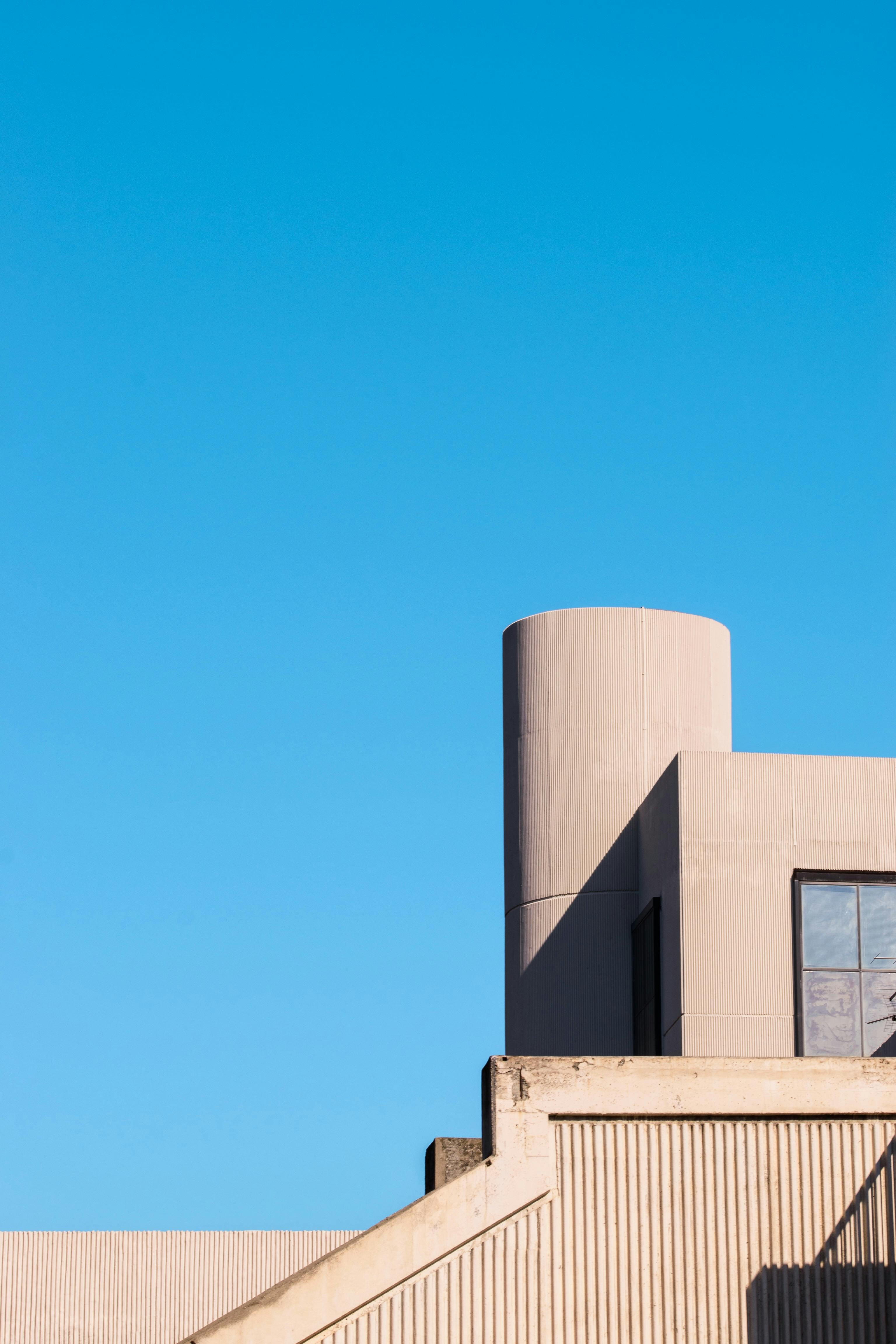 Geometric Modern Architecture Building against Sky · Free Stock Photo