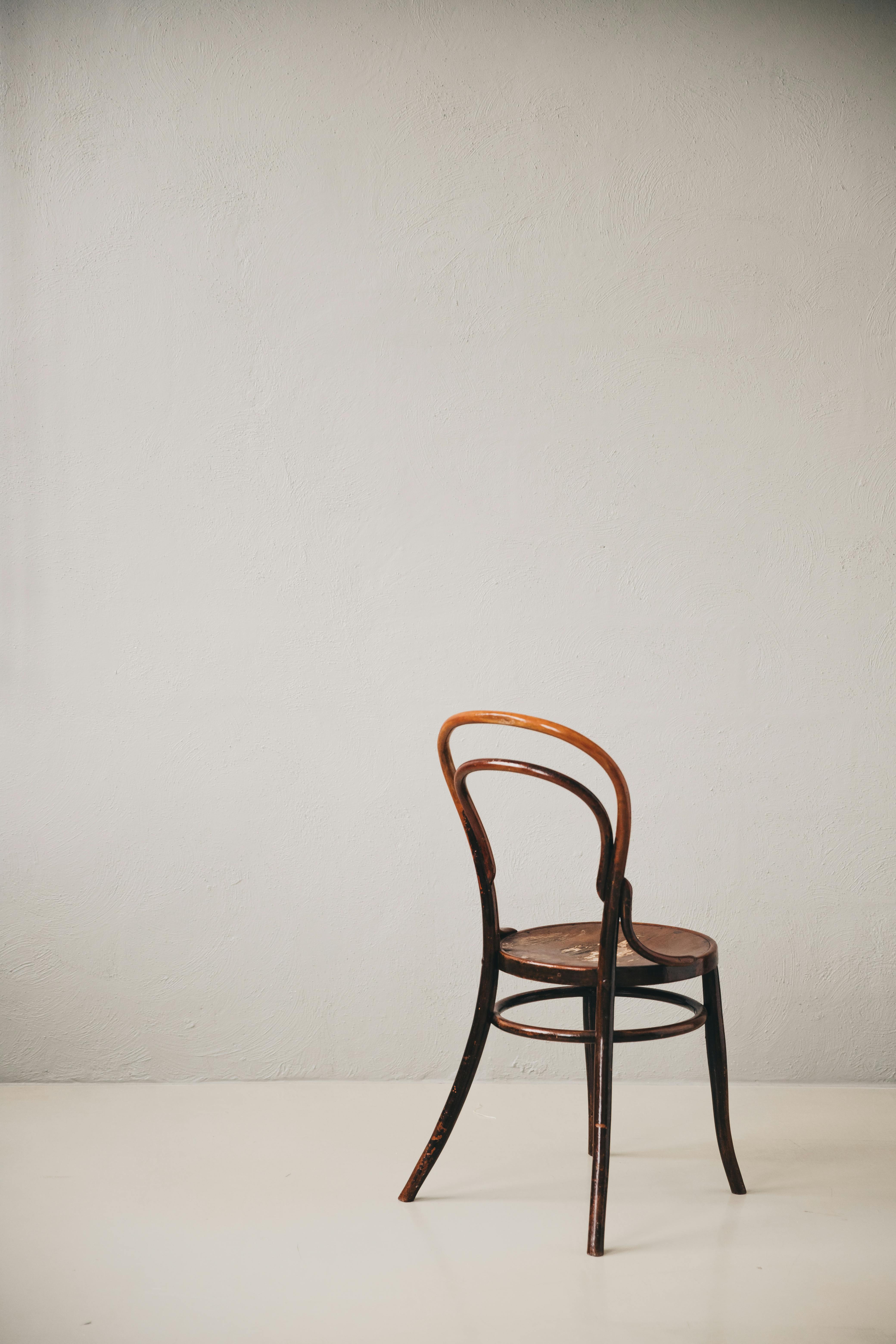 Empty Wooden Chair Near White Wall · Free Stock Photo
