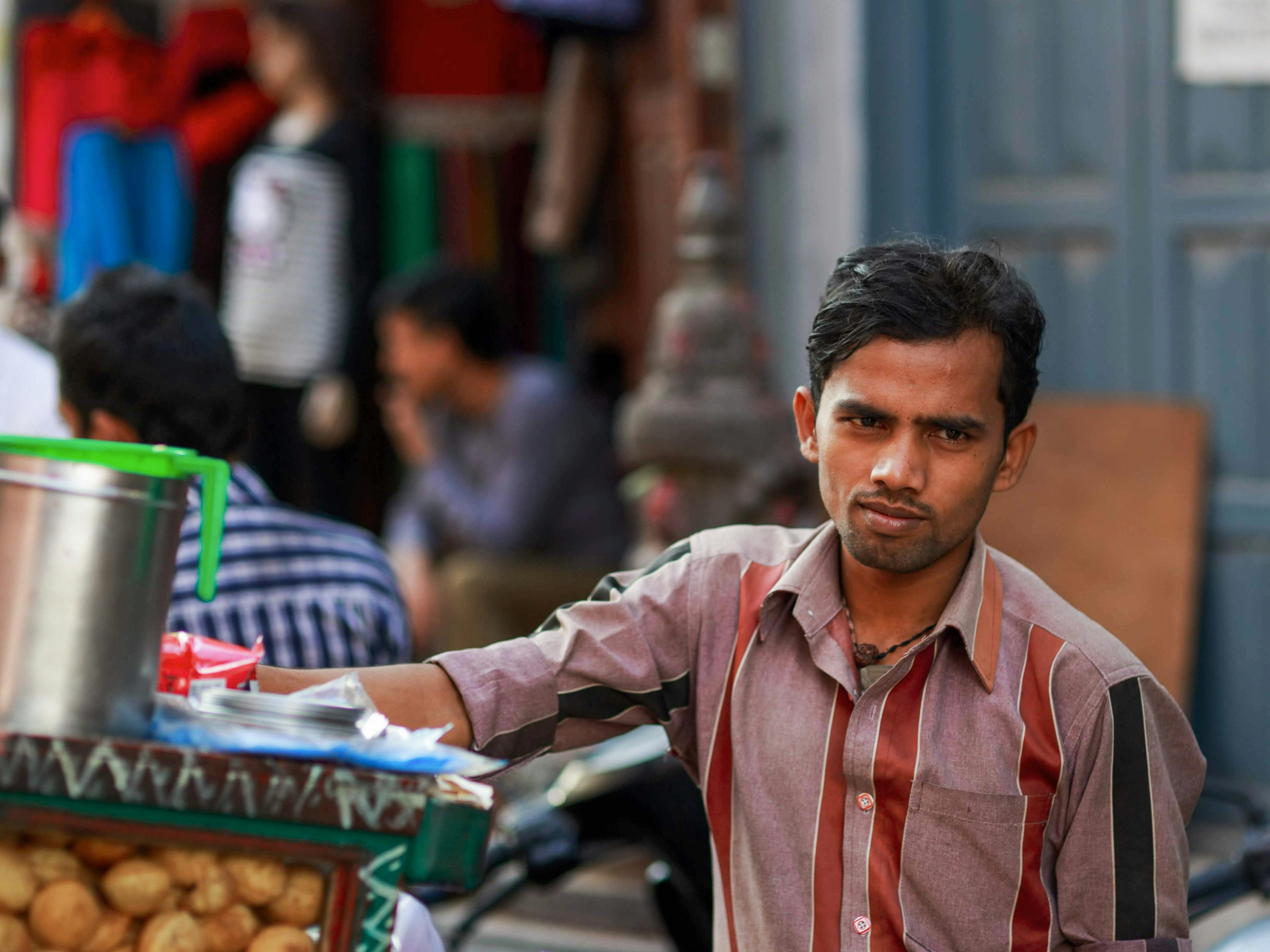 Street Merchant with Vintage Scales · Free Stock Photo