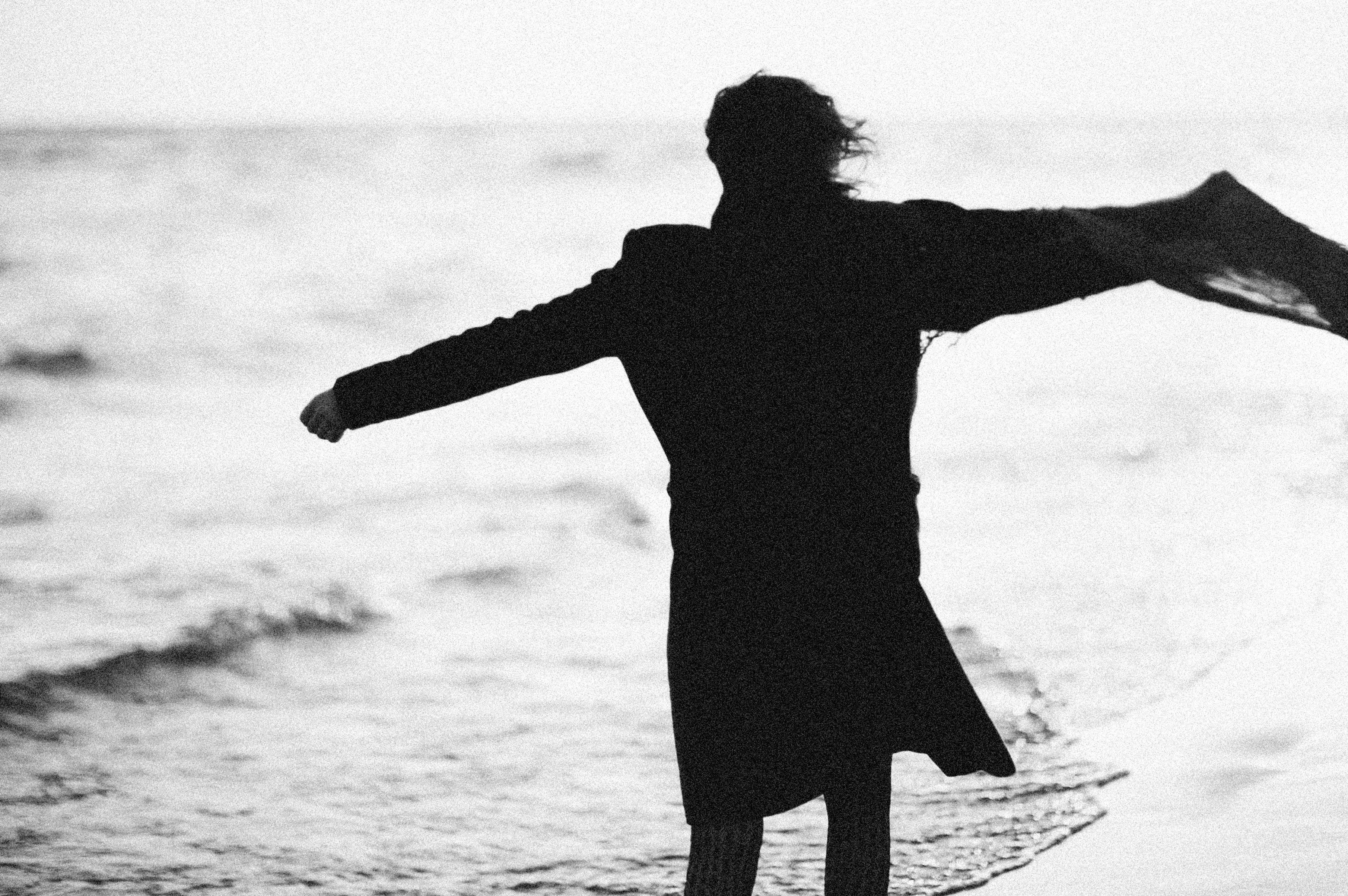Back View of a Woman with Her Arms Apart · Free Stock Photo