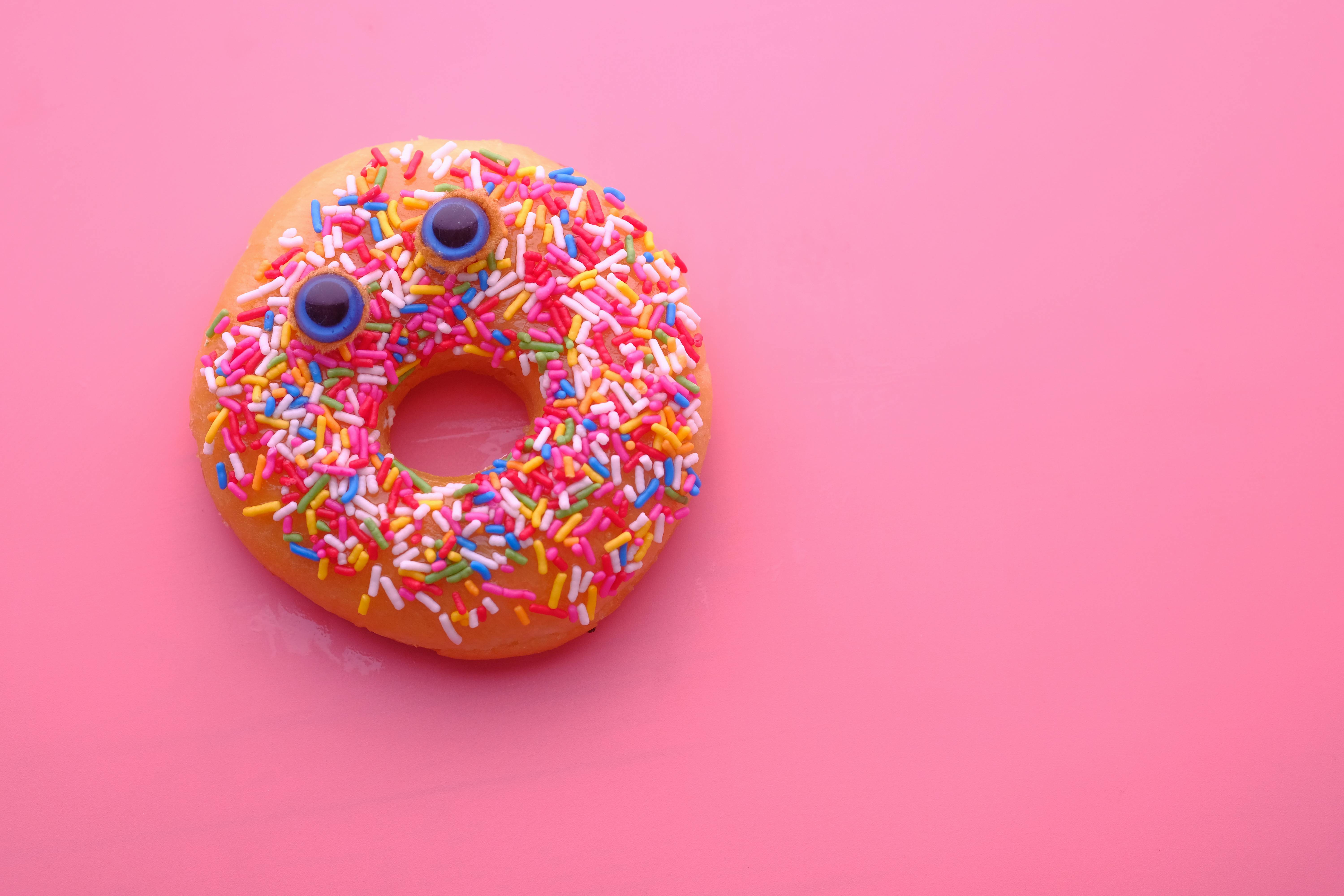 A Person Holding a Donut · Free Stock Photo