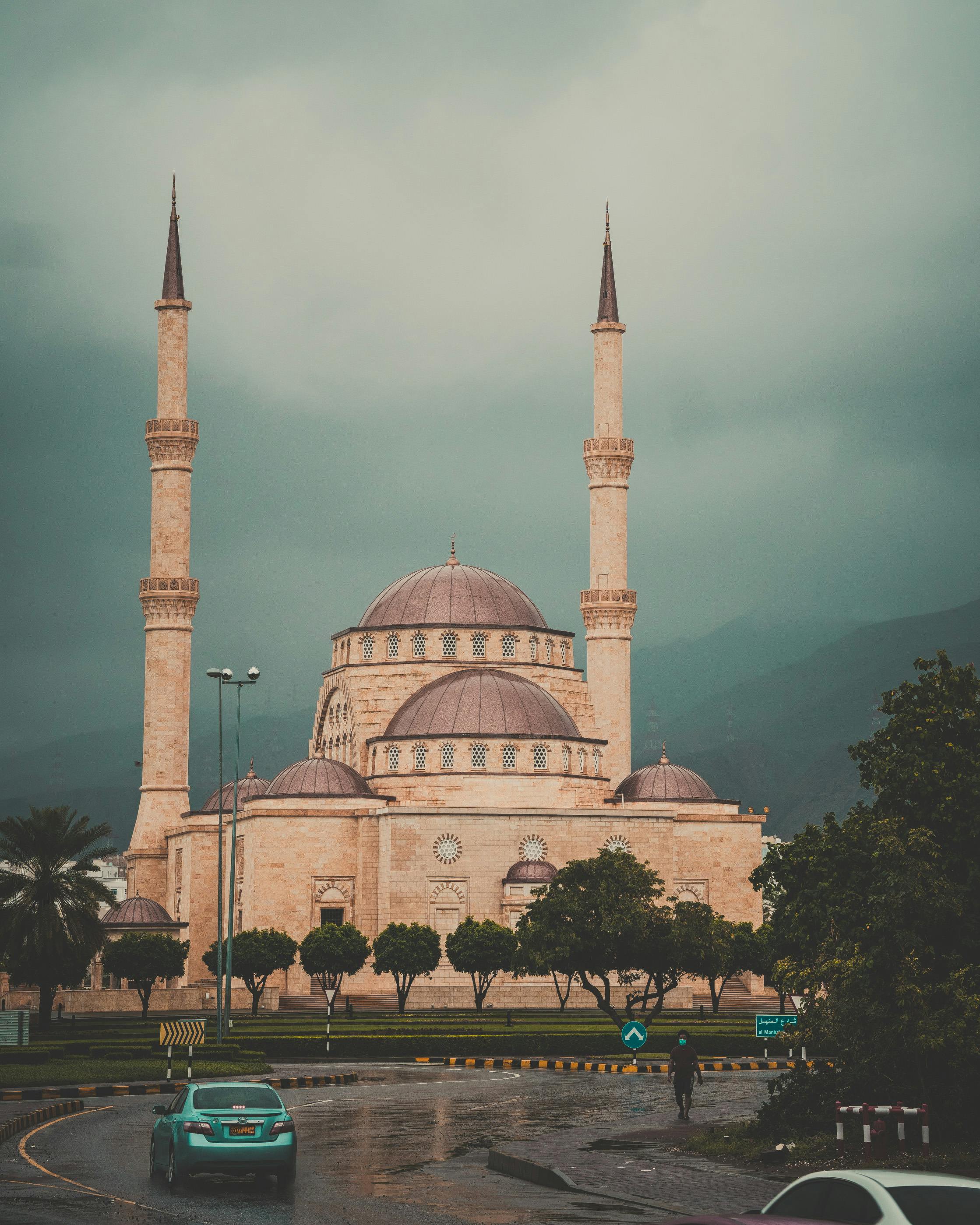 A Brown Concrete Mosque Building · Free Stock Photo