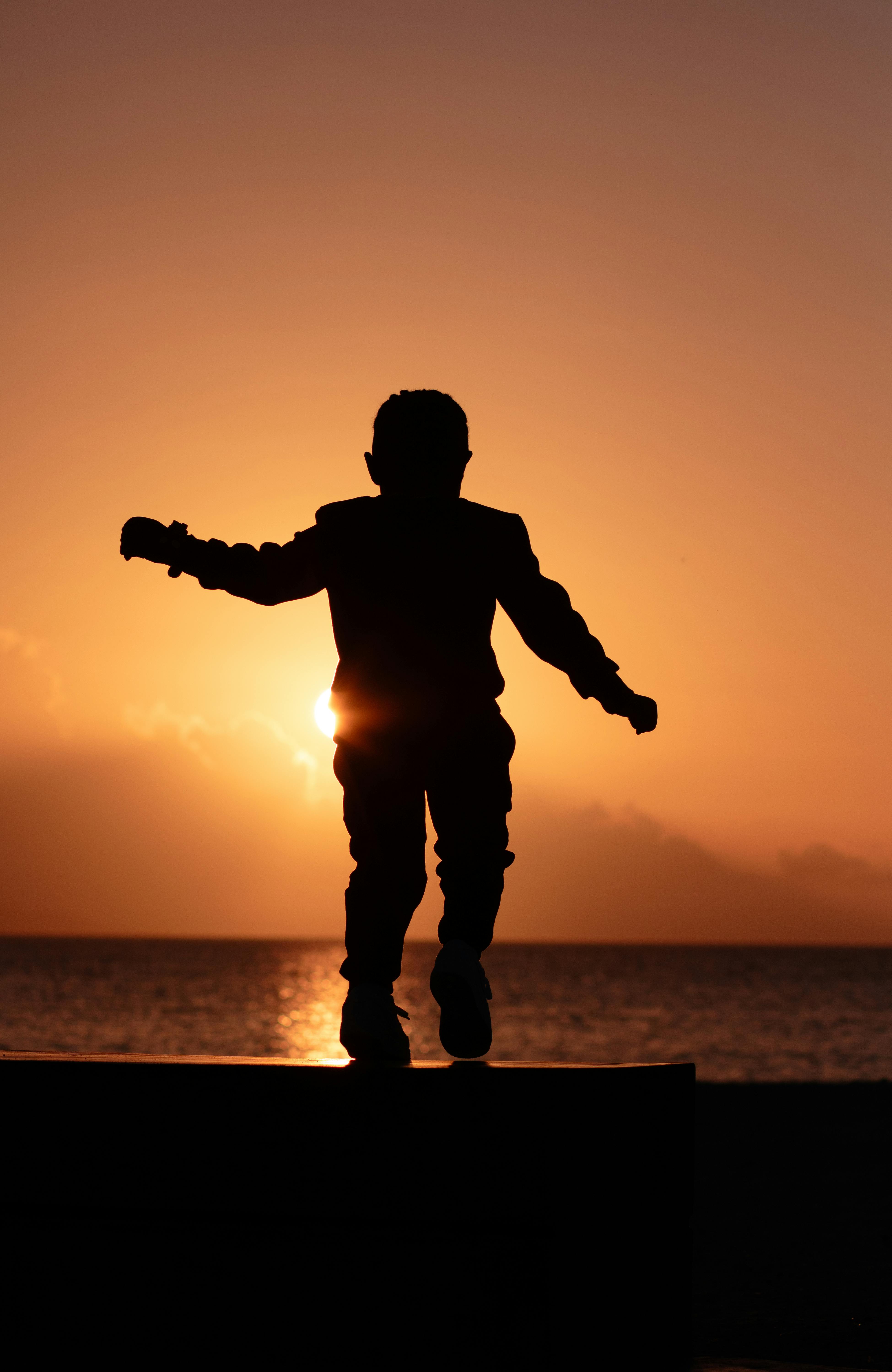 Child on Beach in Sunset · Free Stock Photo