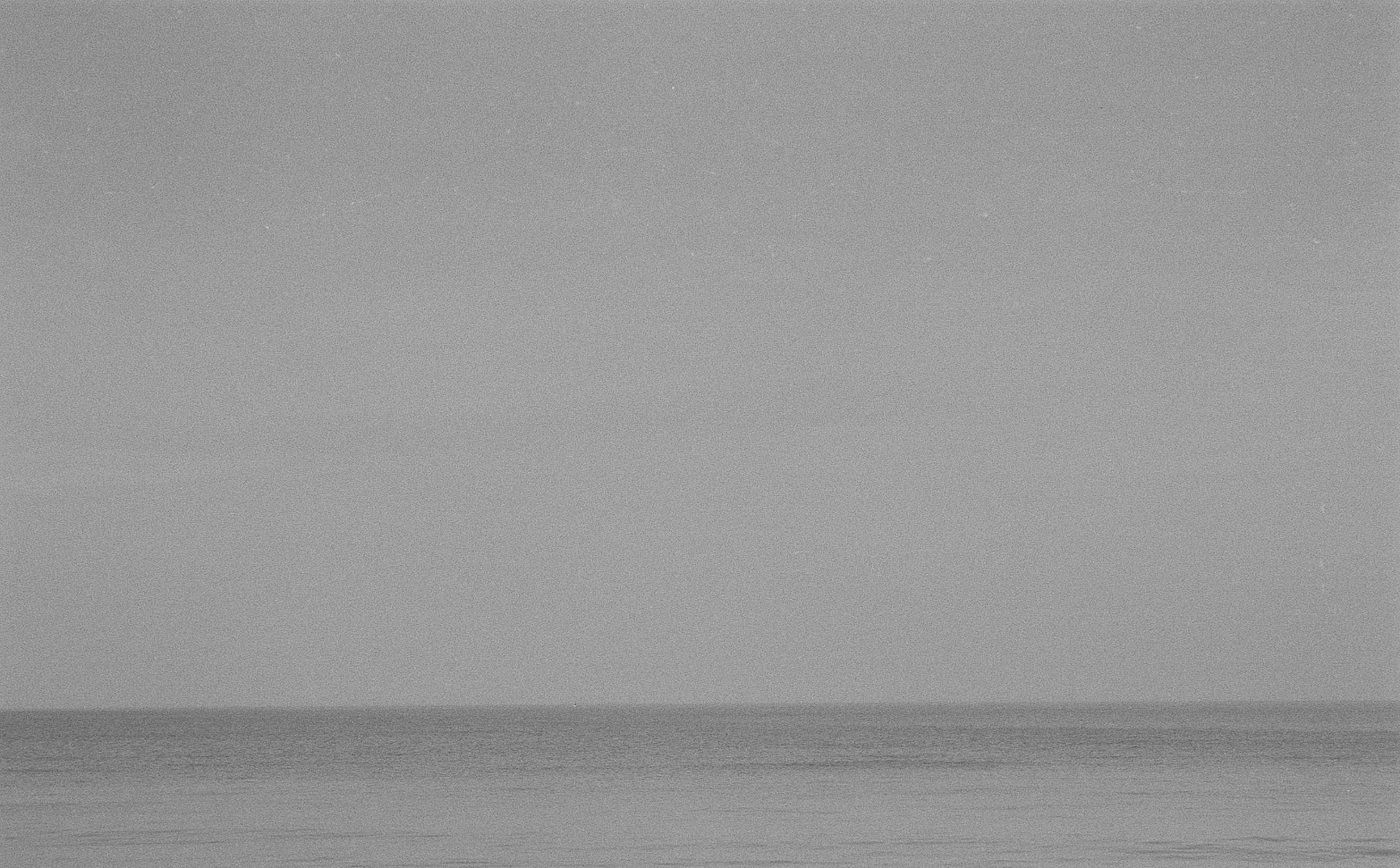 Grayscale Photo of the Sea · Free Stock Photo