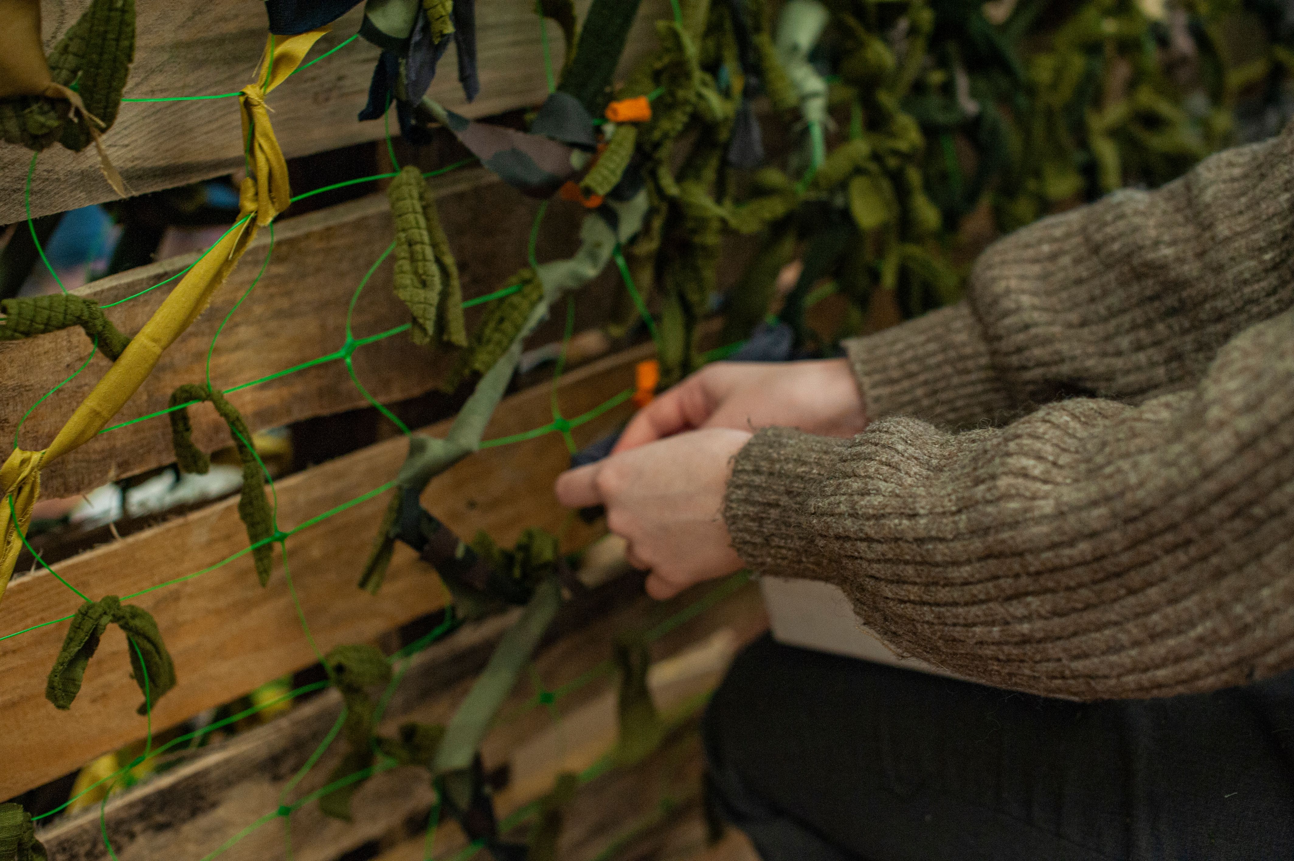 Woman Making Camouflage Nets · Free Stock Photo