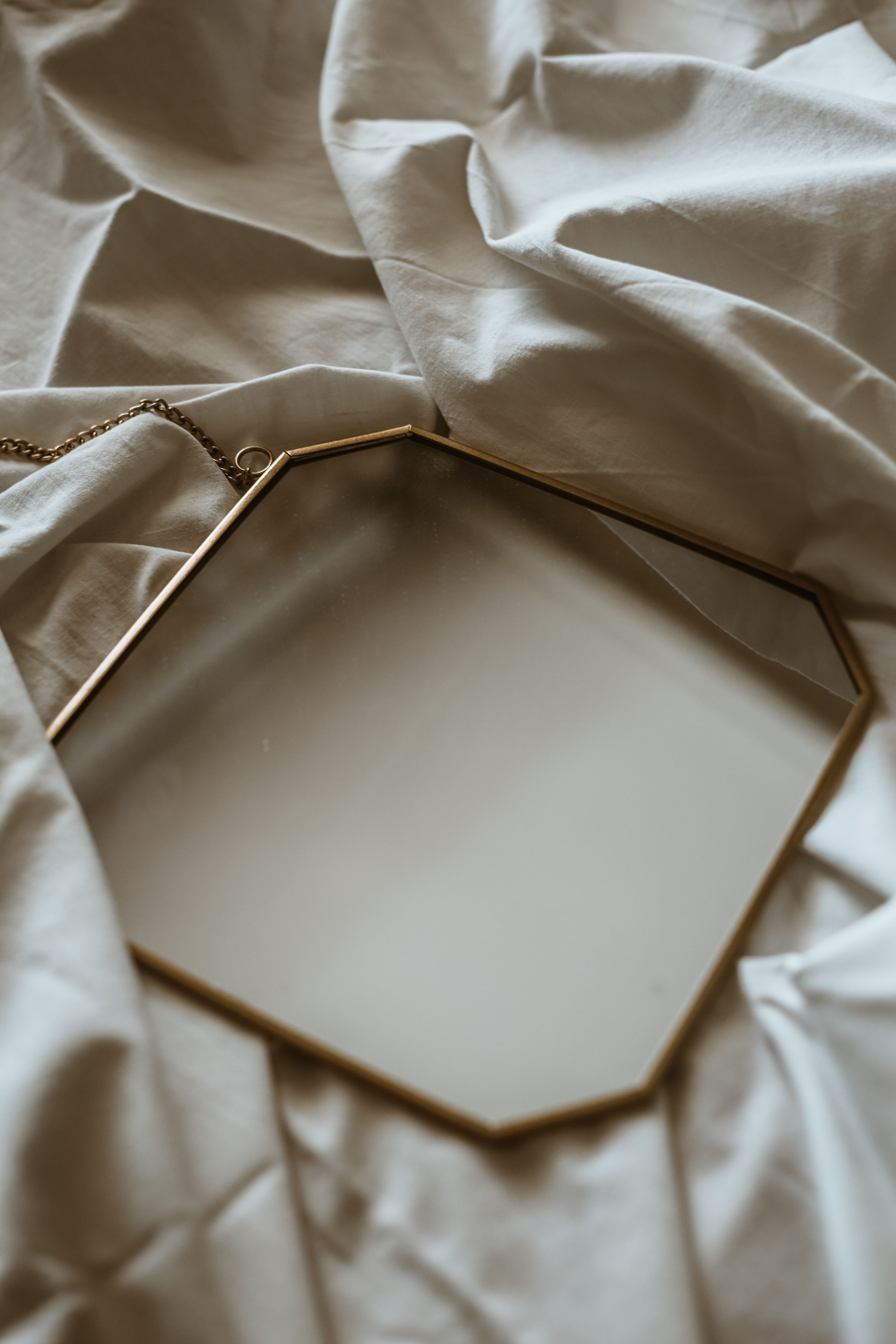 Mirror Lying on Open Book · Free Stock Photo