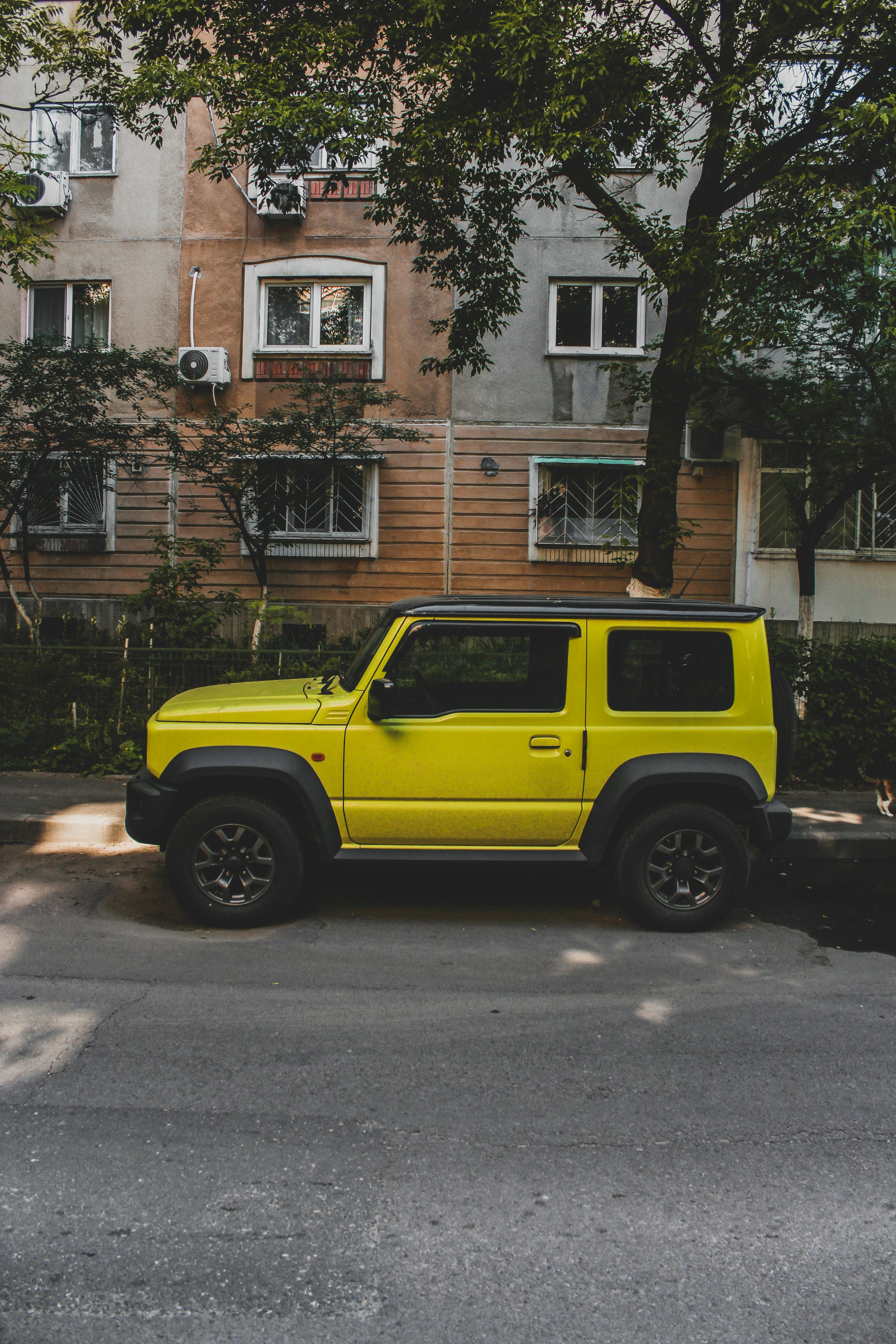 Yellow SUV Parked on Roadside · Free Stock Photo
