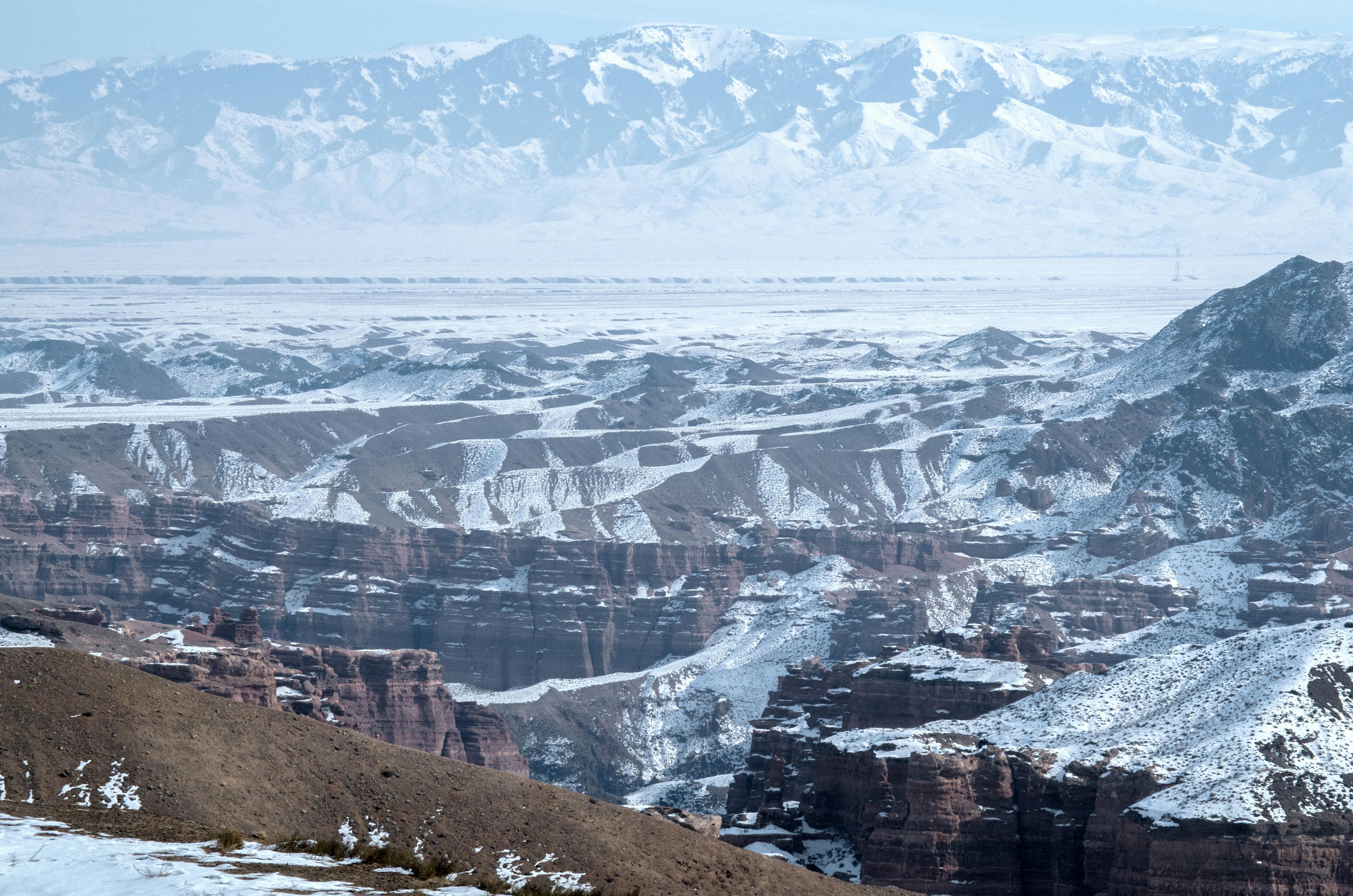 Aerial View of Snowy Brown Mountains · Free Stock Photo