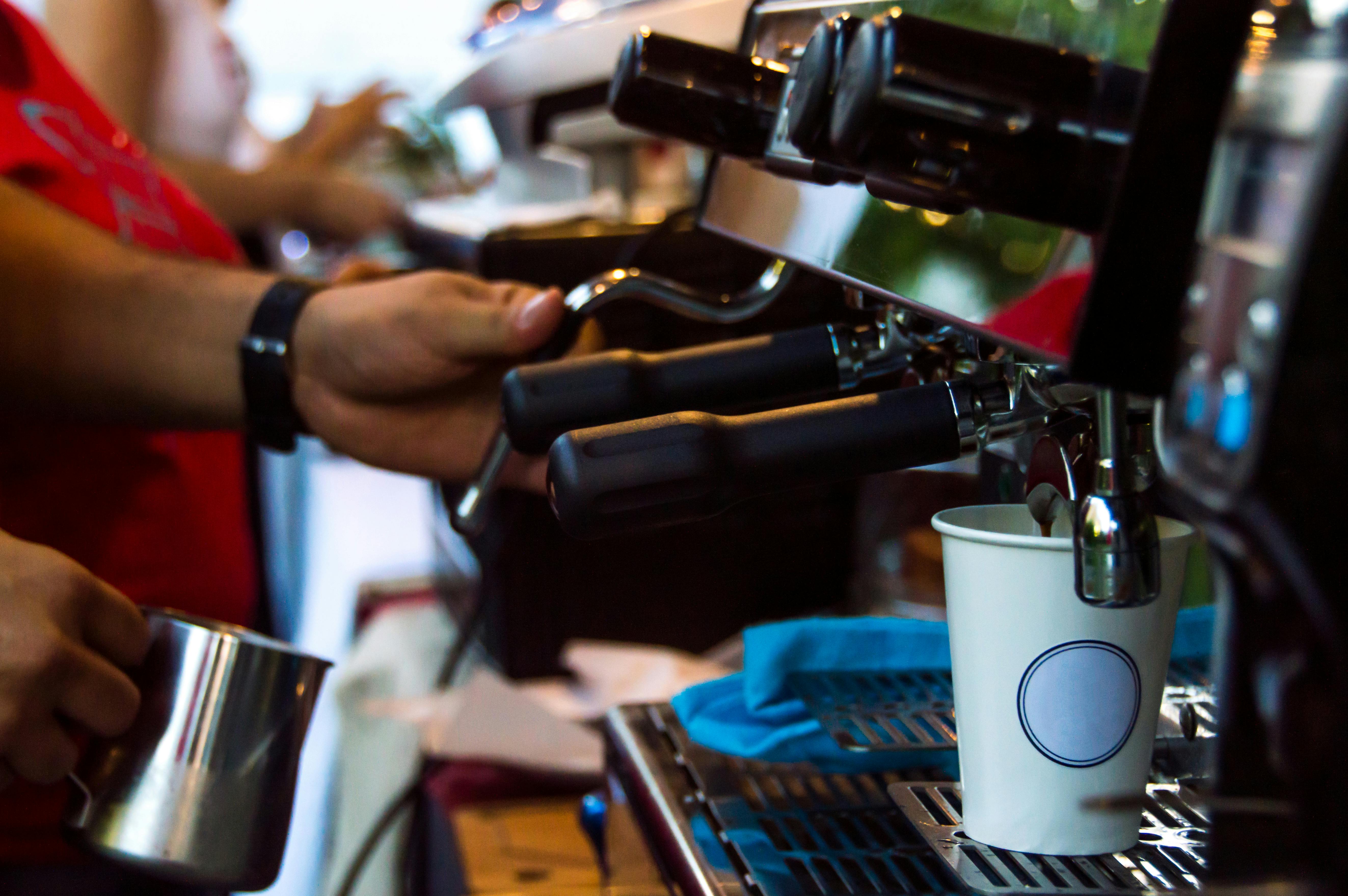 Barista Pouring Milk into Cafe Latte · Free Stock Photo