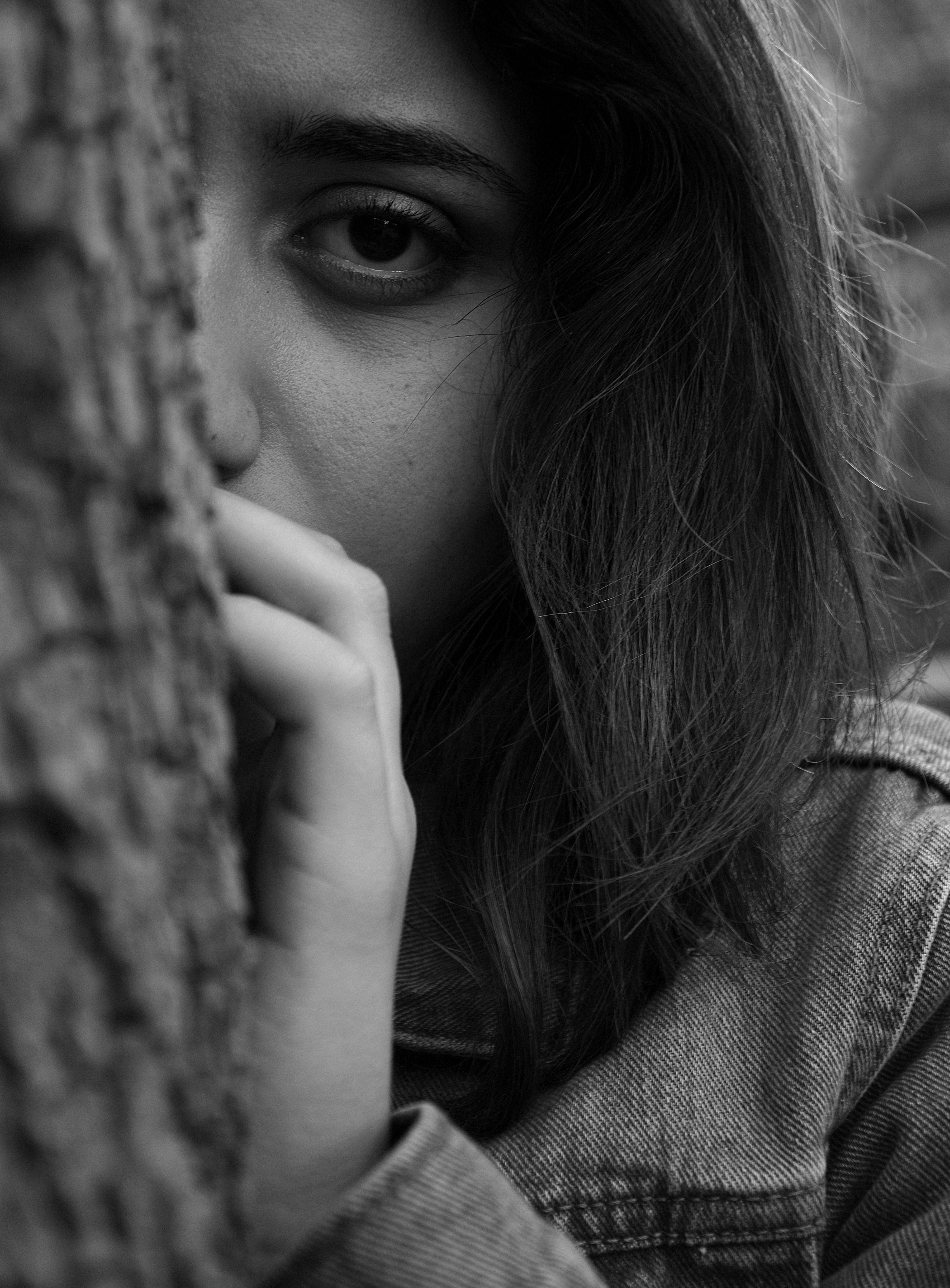 Grayscale Photography of Woman Behind Tree Trunk · Free Stock Photo