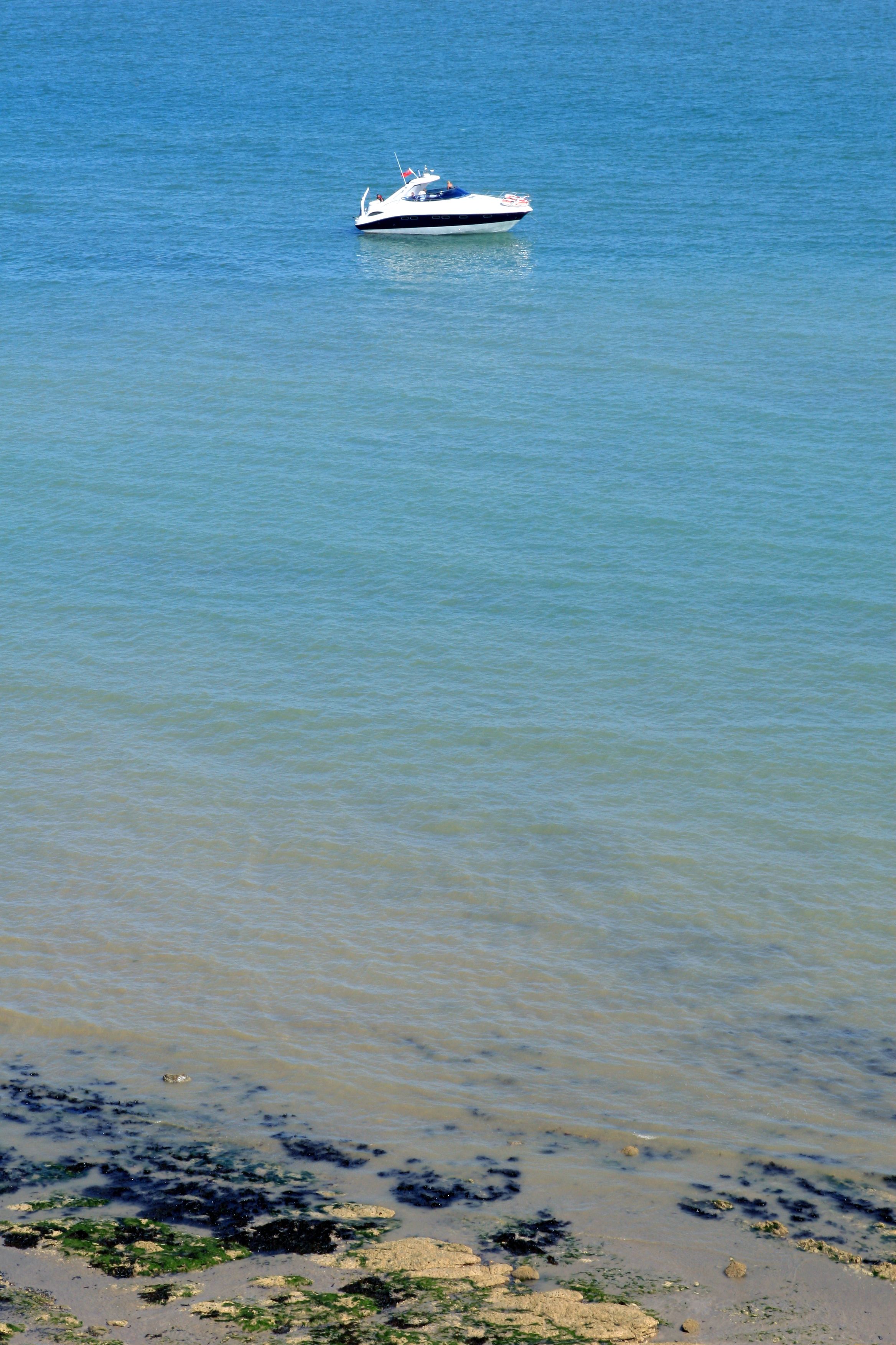 Photo of a Boat on Waterside · Free Stock Photo