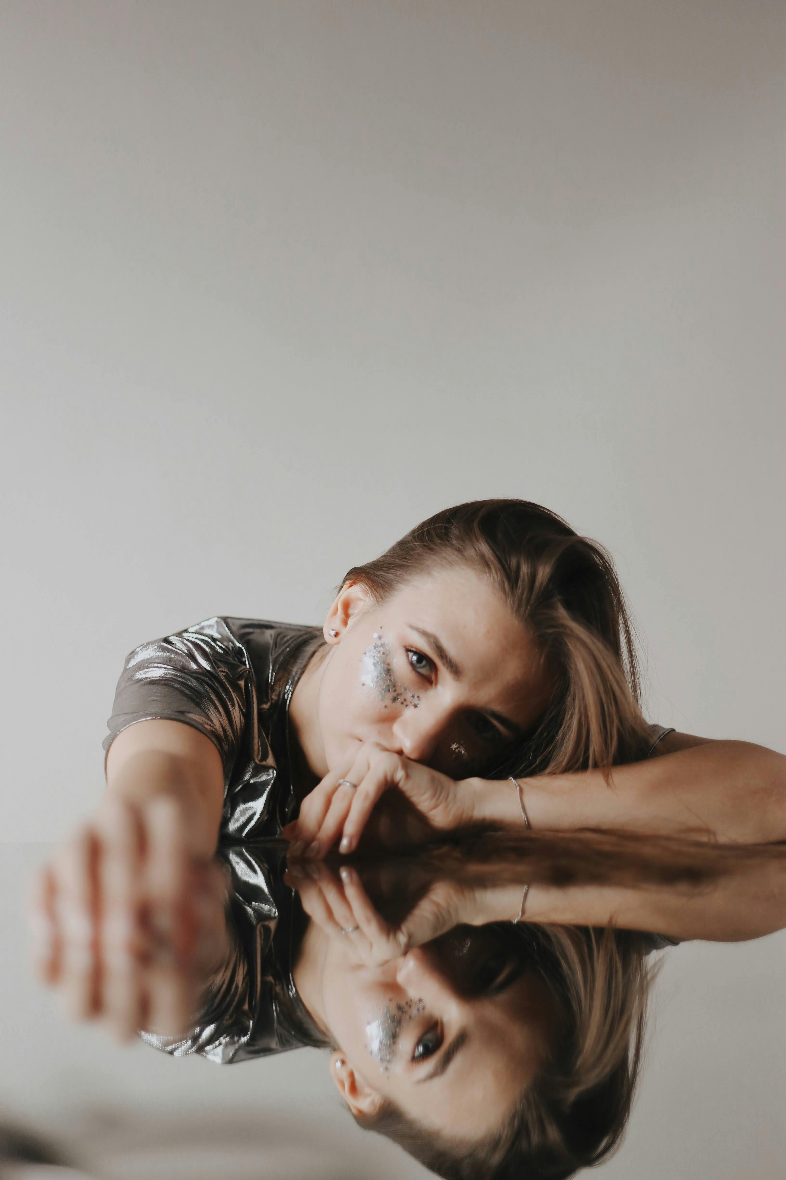 Portrait of Woman with her Reflection on the Table · Free Stock Photo