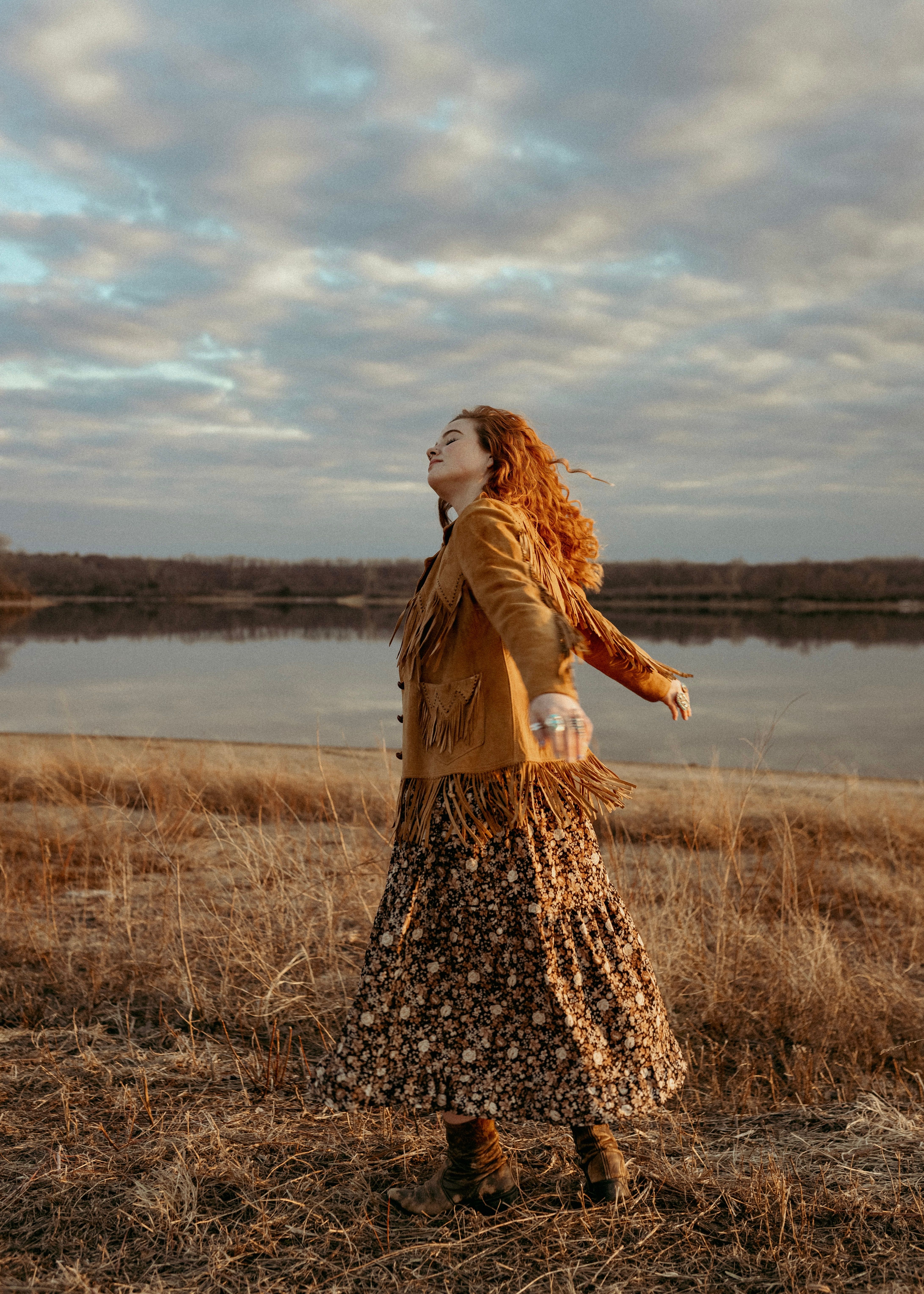 Ginger Woman Dancing in Open Field · Free Stock Photo