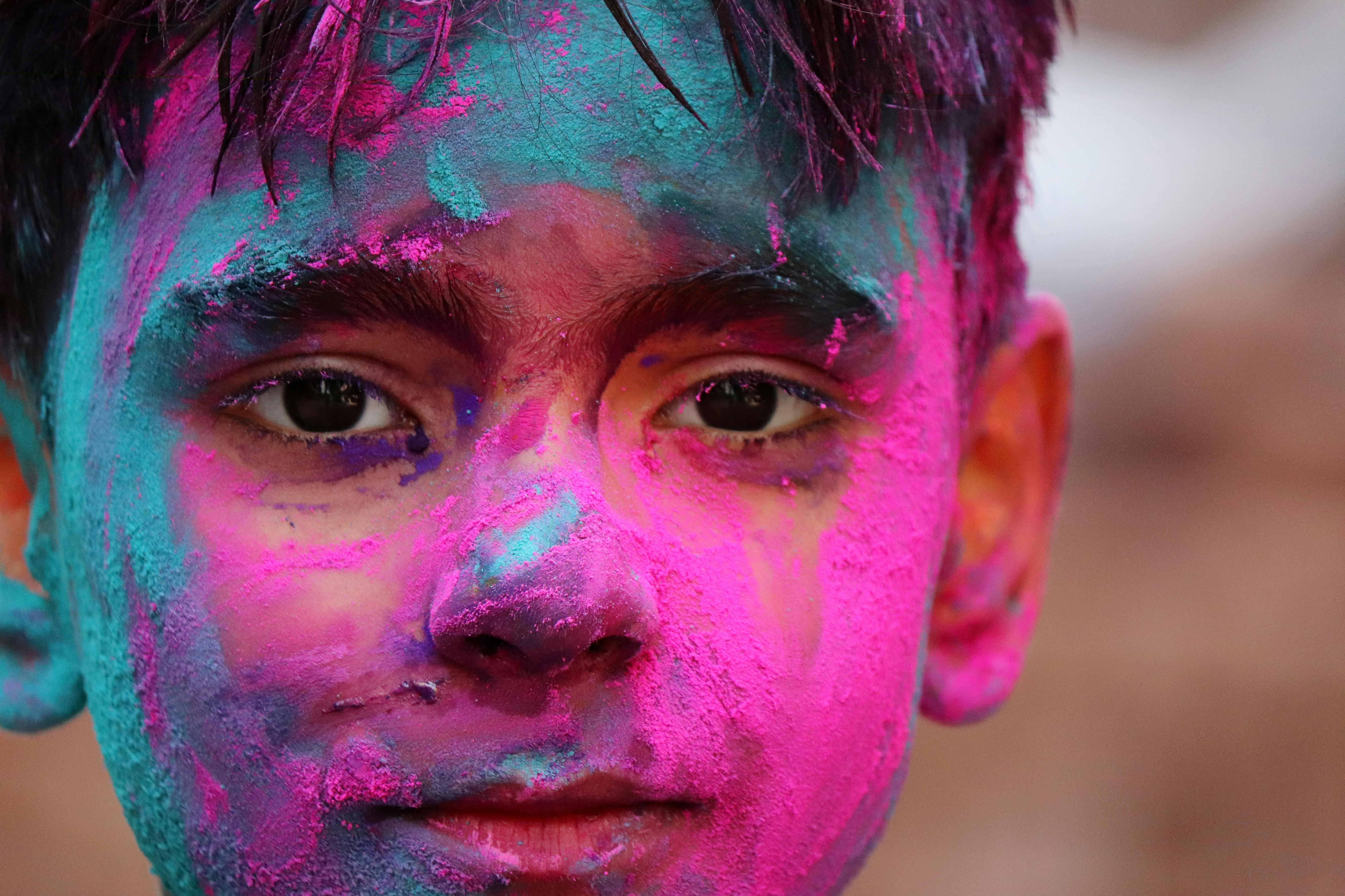 Young Man With Colorful Paint on Face · Free Stock Photo