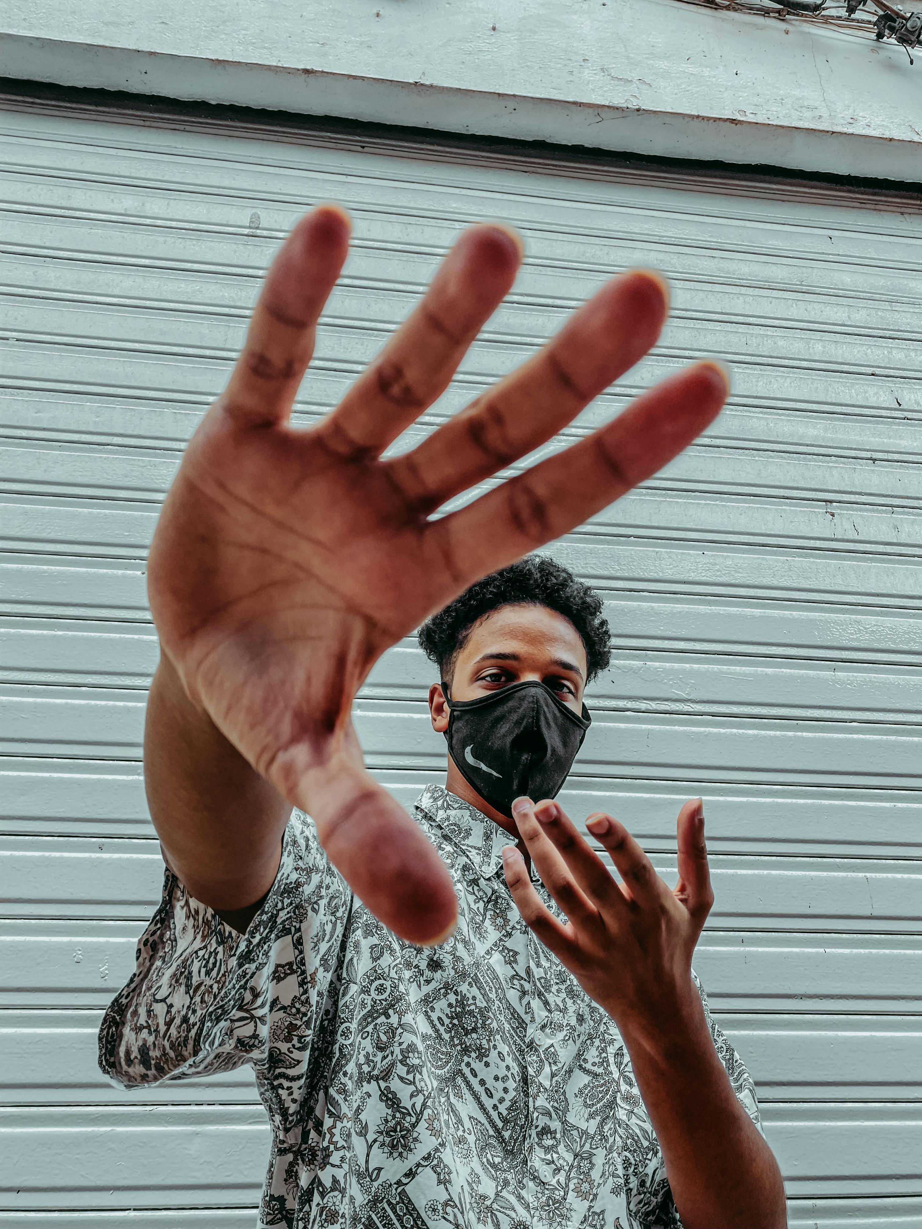 Photo of People Doing the Stop Hand Gesture · Free Stock Photo