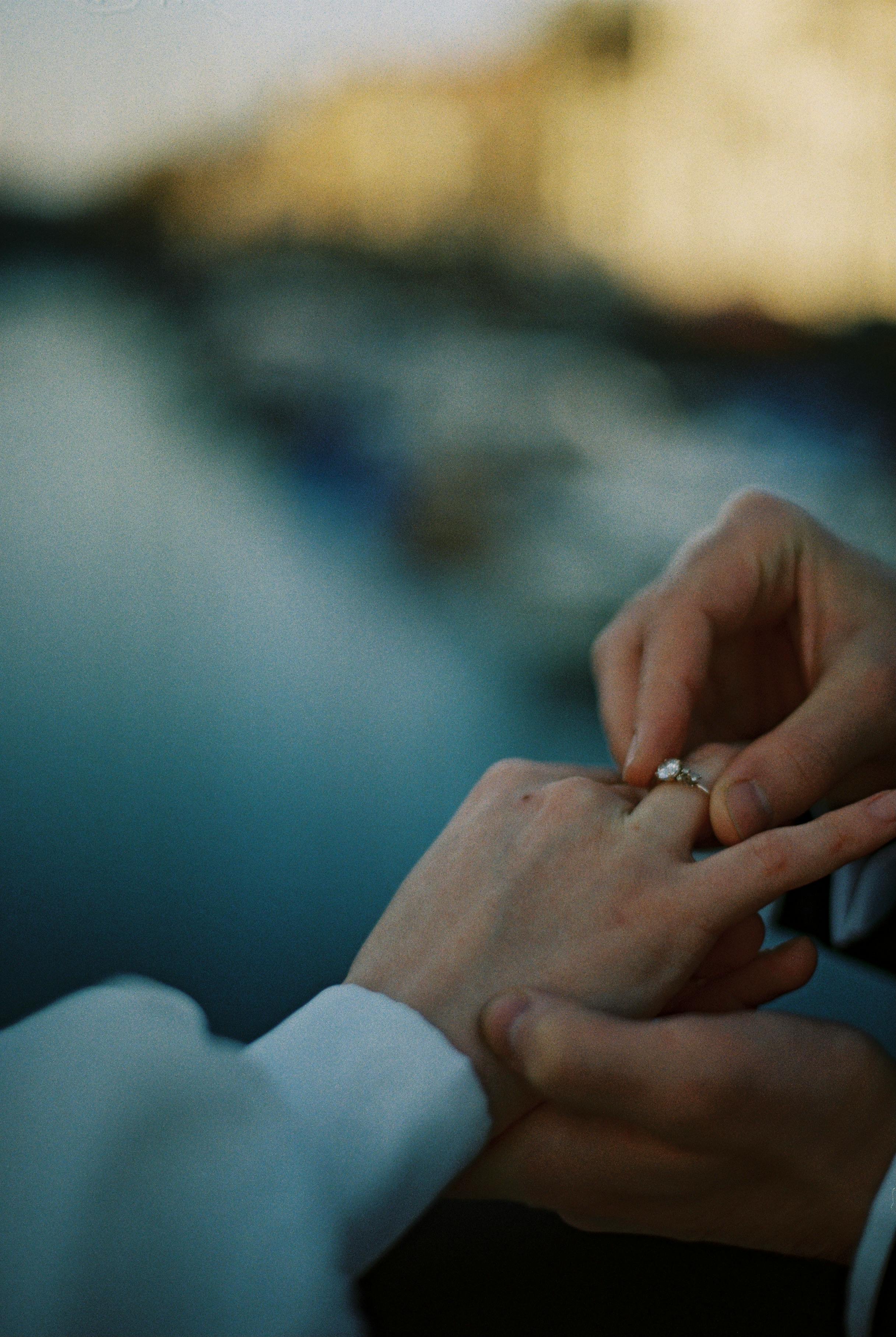 Photo of Hands Holding Rings · Free Stock Photo