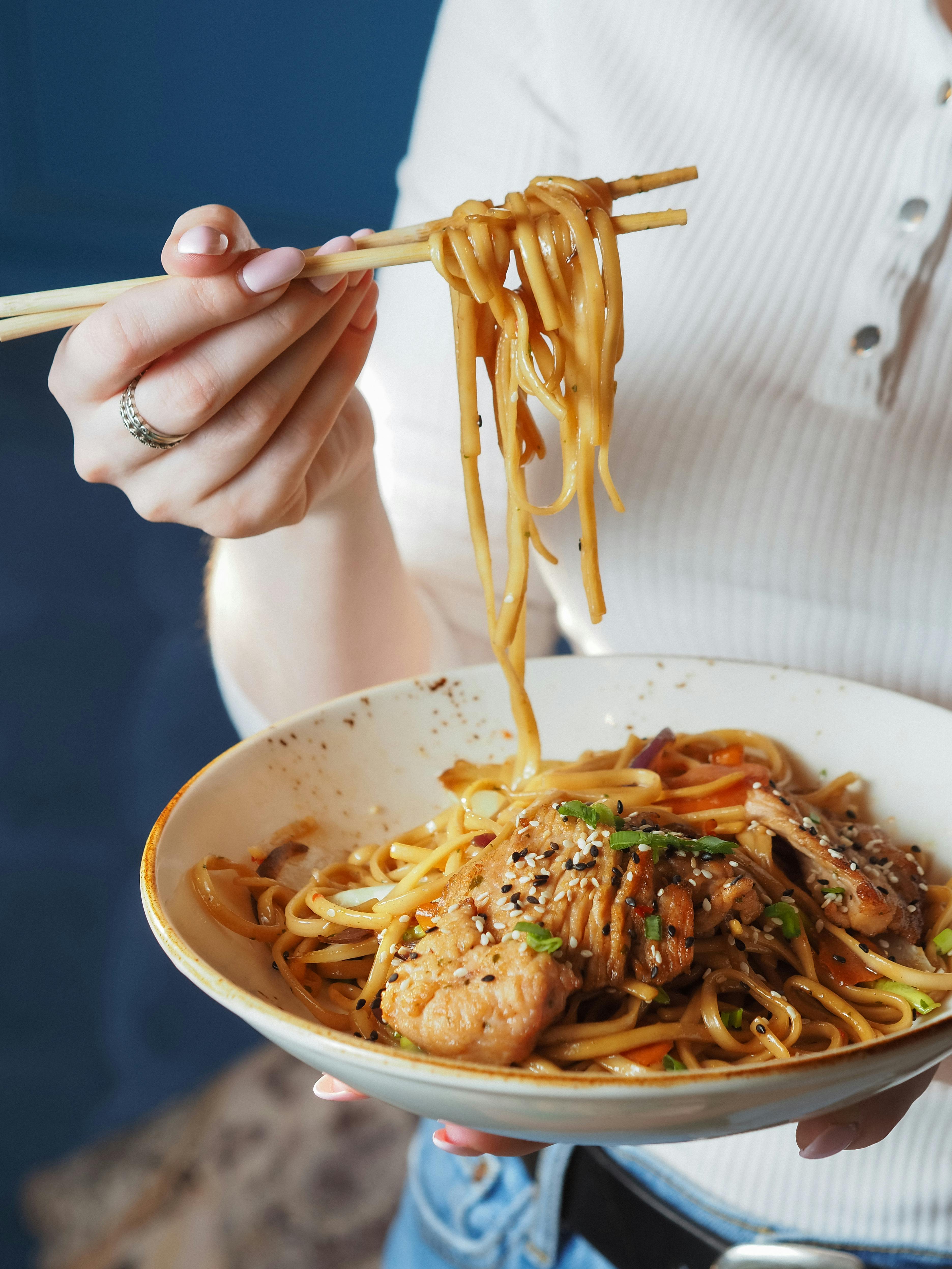 Person Eating Noodles on a Bowl · Free Stock Photo